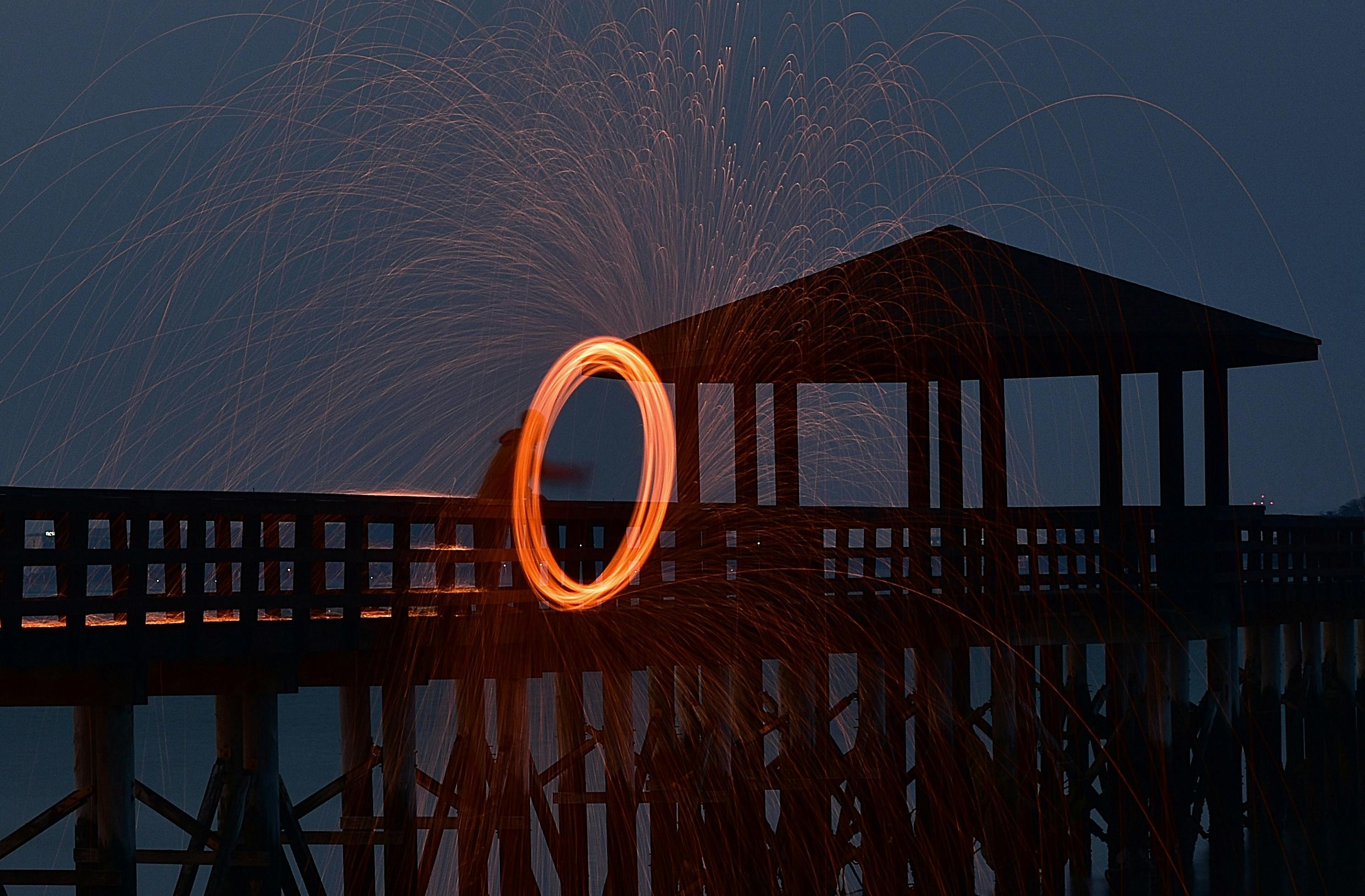 Steel Wool Spinning on Pier · Free Stock Photo