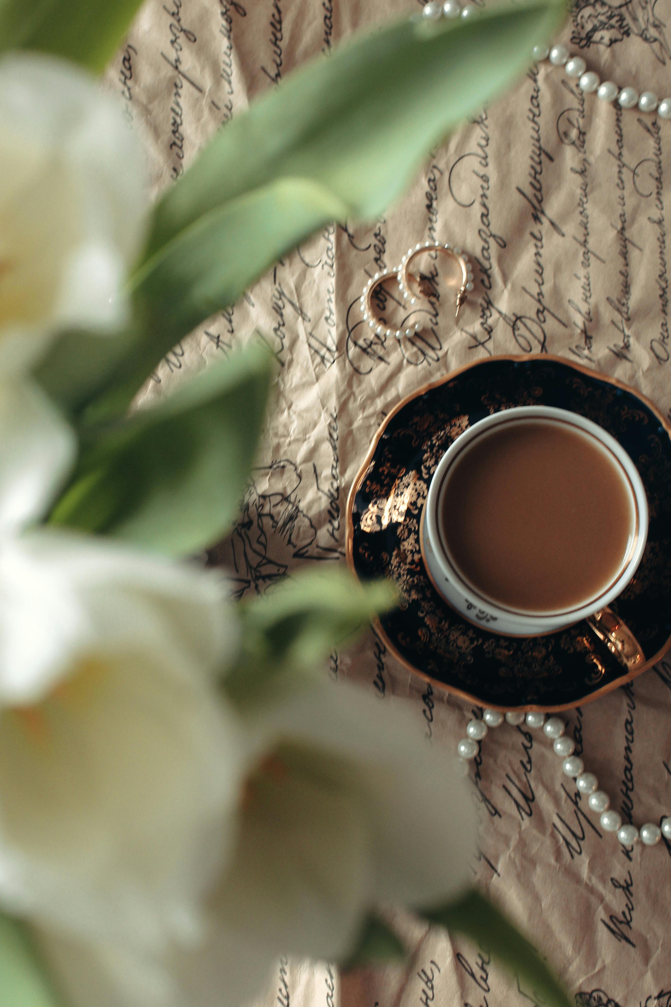 Leaves and Accessories around Tea Cup · Free Stock Photo