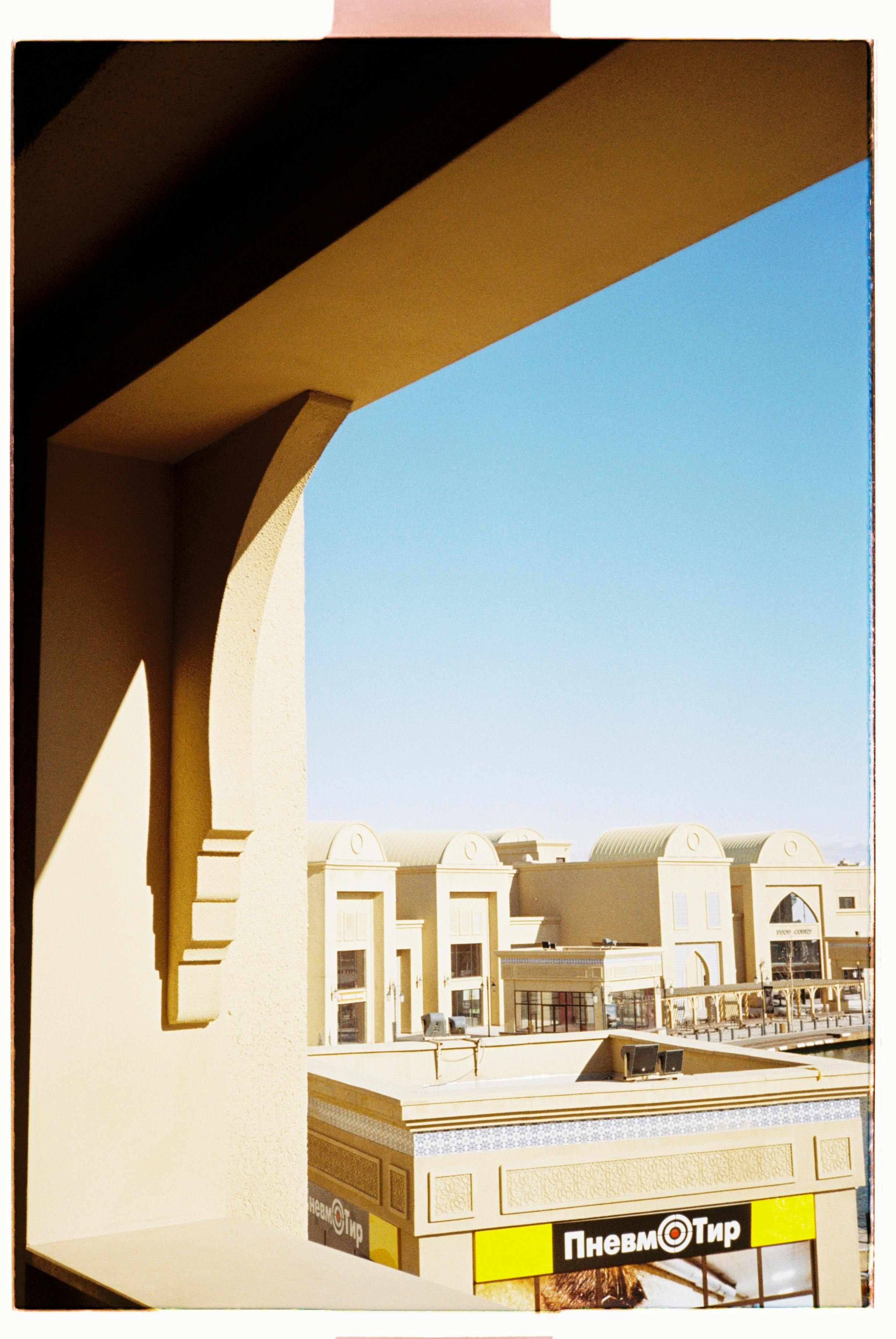 Beige Buildings in City seen from a Balcony under a Blue Sky · Free ...