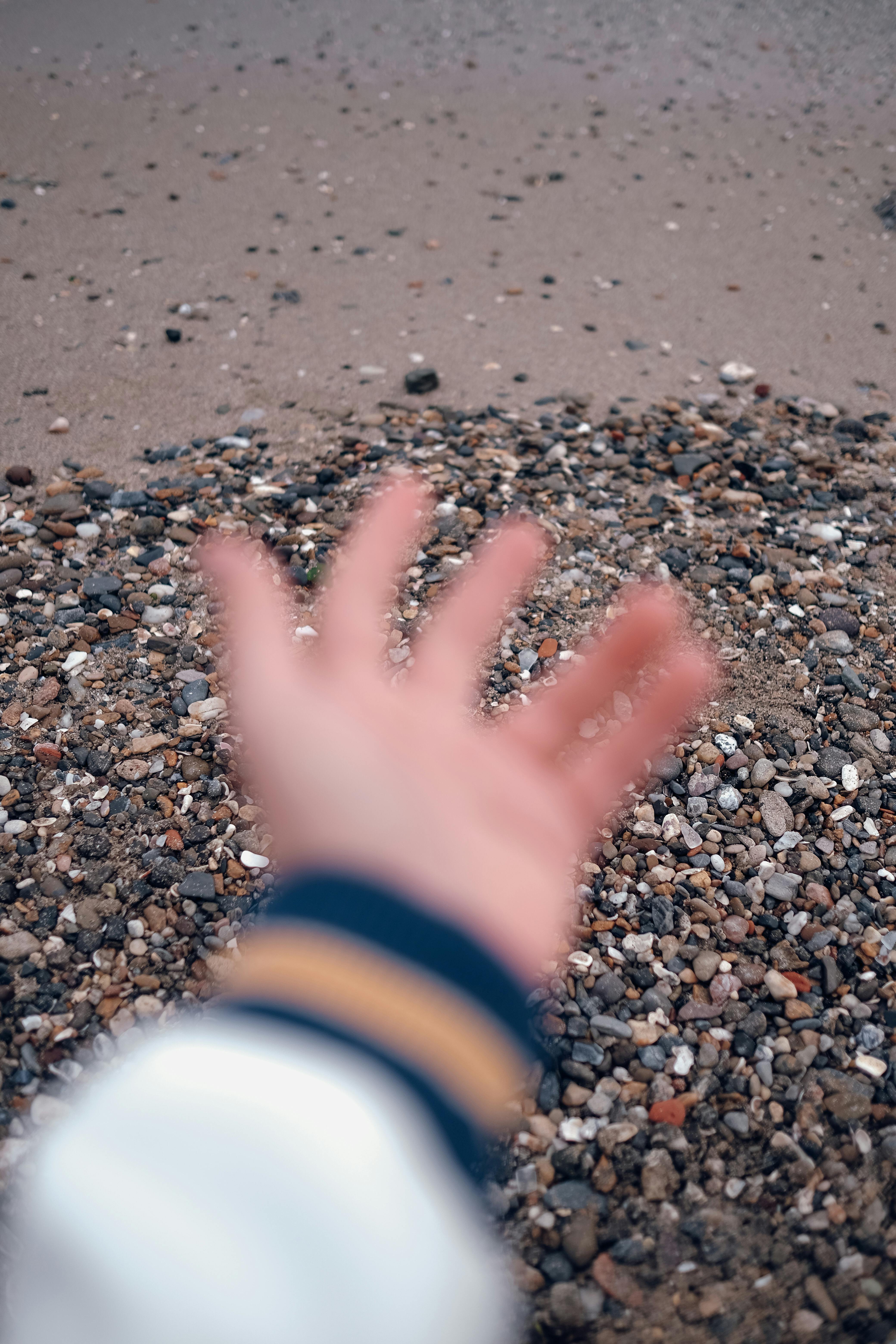 Defocused Picture of an Arm of a Person on the Background of a Beach ...