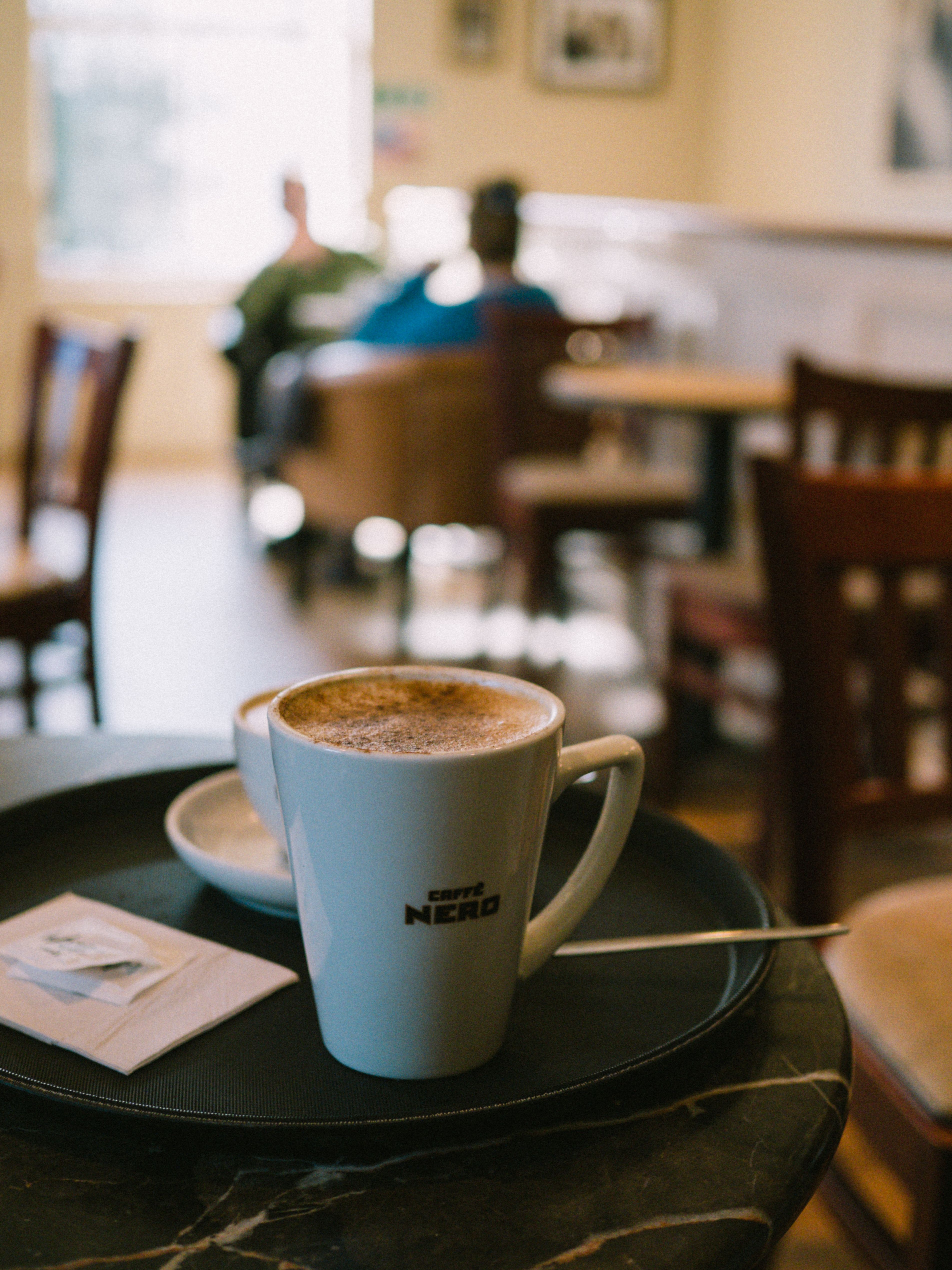 Text on Coffee Cup on Counter · Free Stock Photo