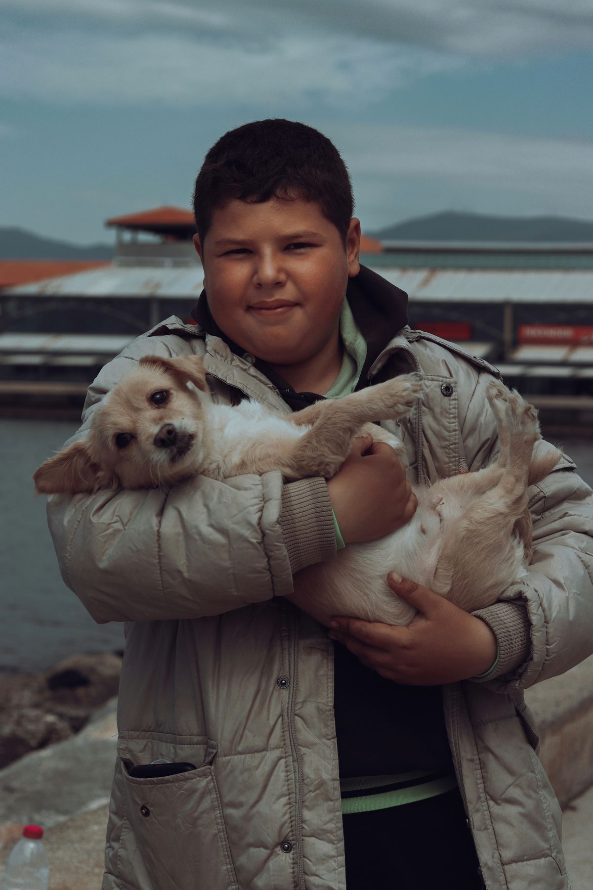 Boy Carrying A Dog Photos, Download The BEST Free Boy Carrying A Dog ...