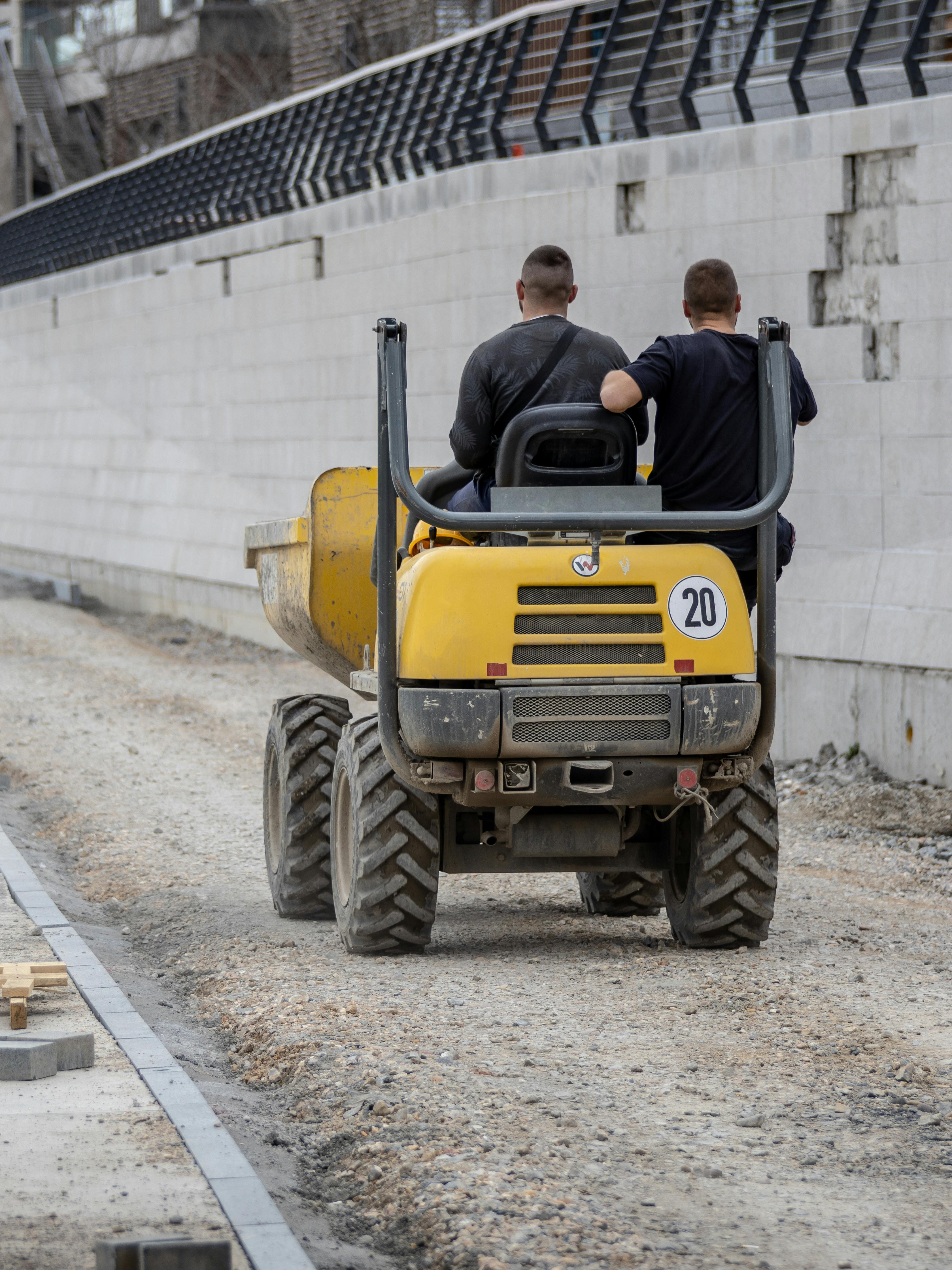 Men Going in Wheel Dumper · Free Stock Photo