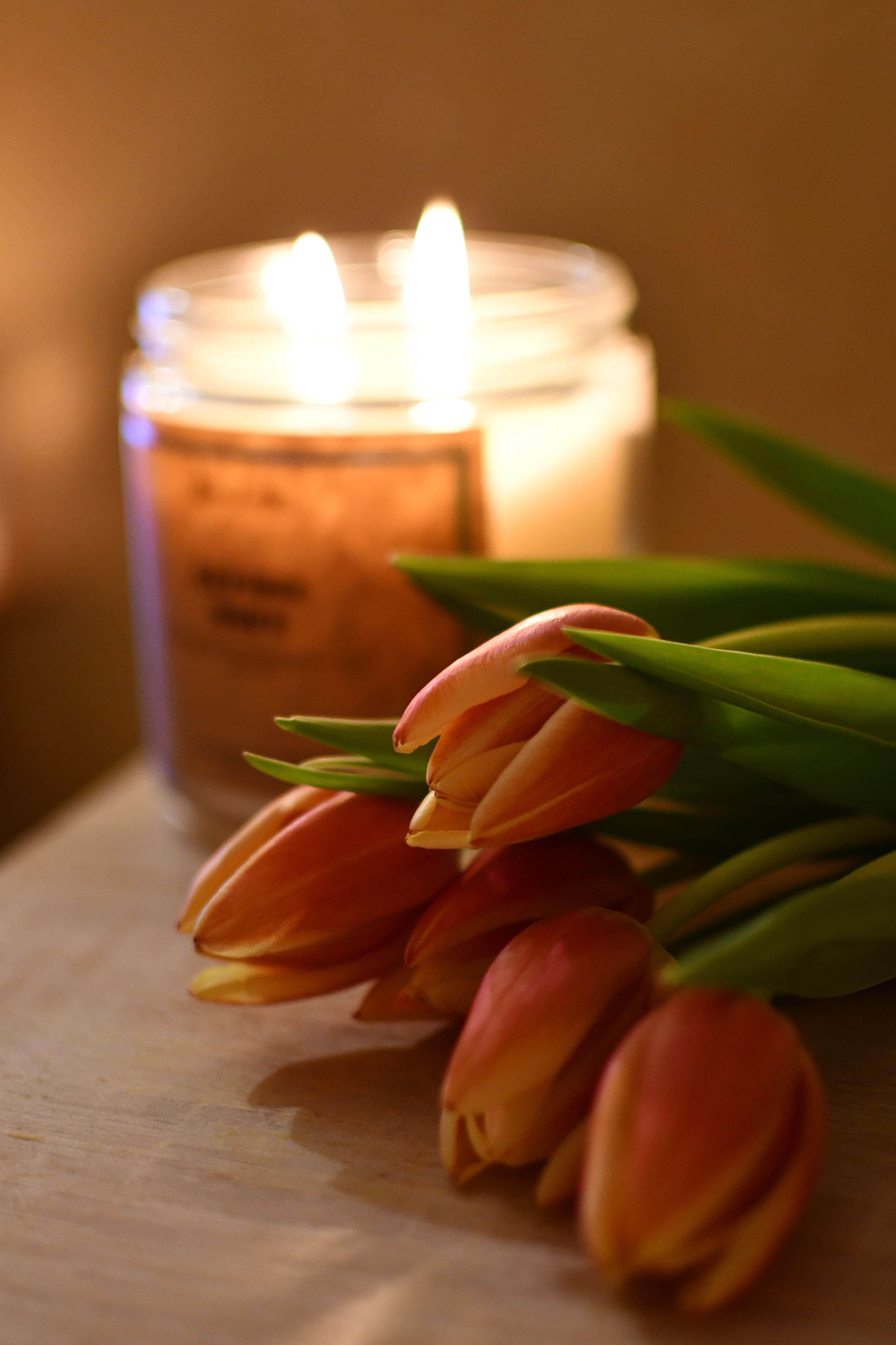 Feather and Candle on a Sand Castle · Free Stock Photo