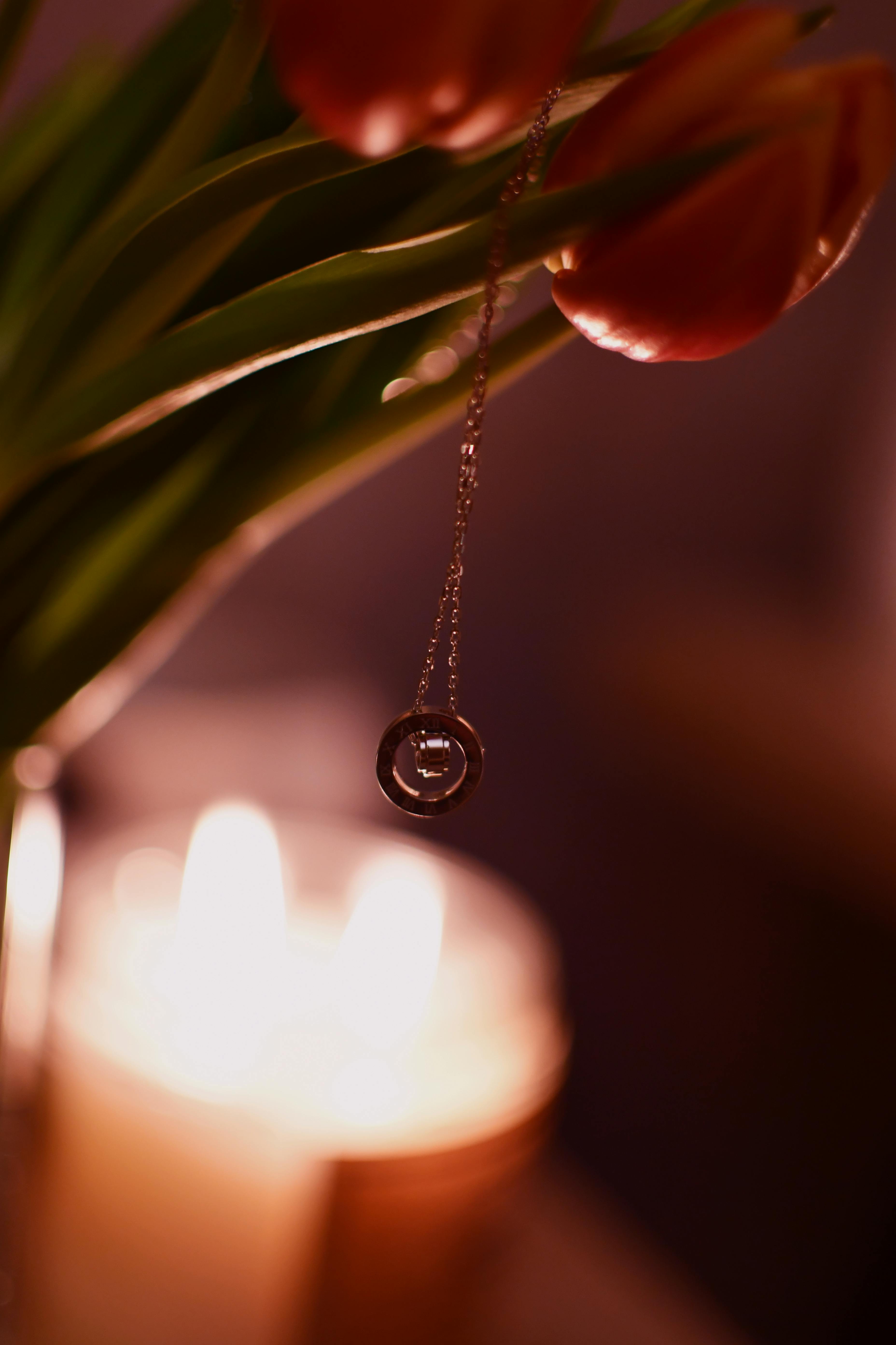 Pendant Hanging over Wax Candles · Free Stock Photo