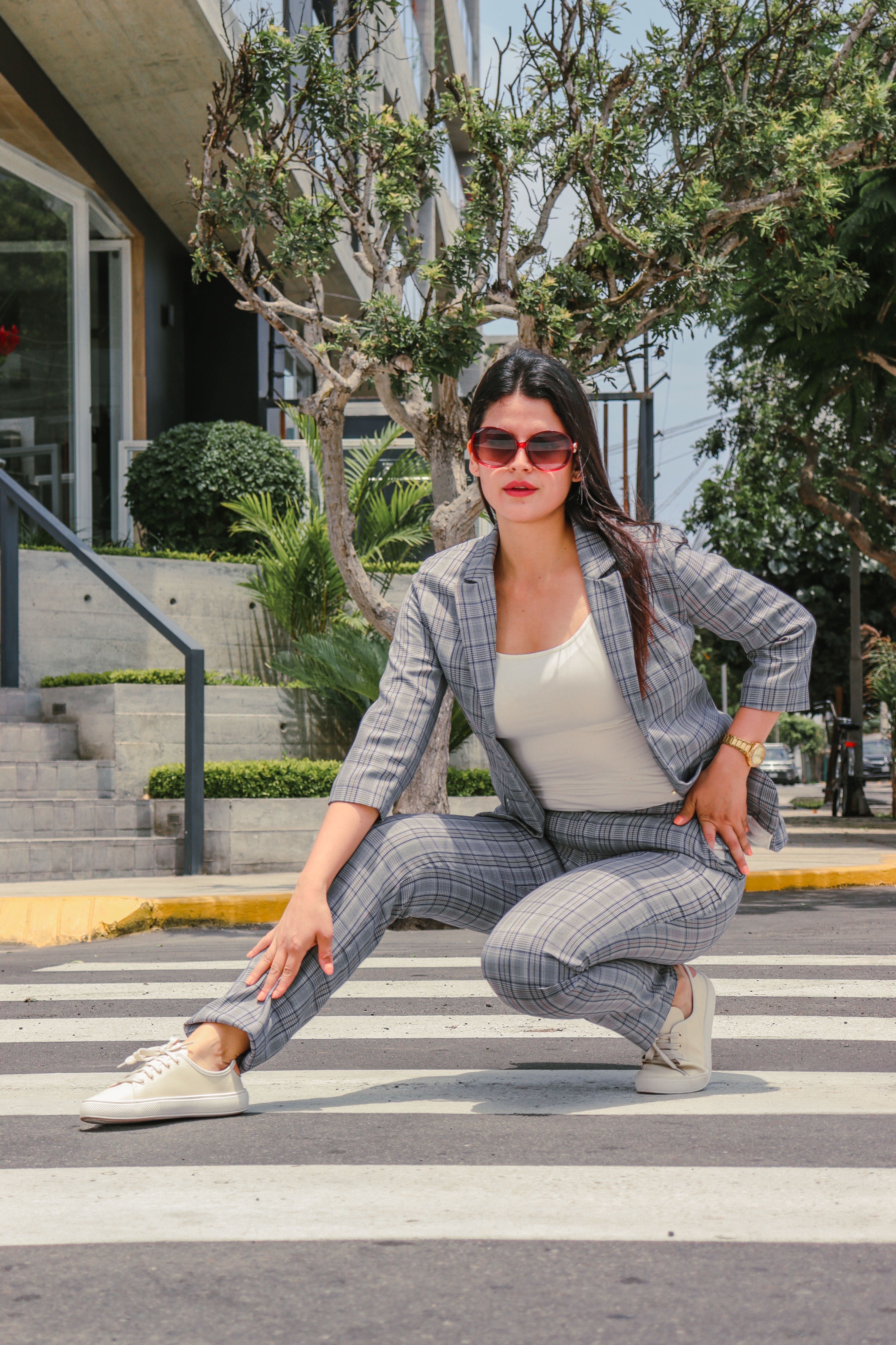 Woman in Suit Crouch on Crosswalk · Free Stock Photo