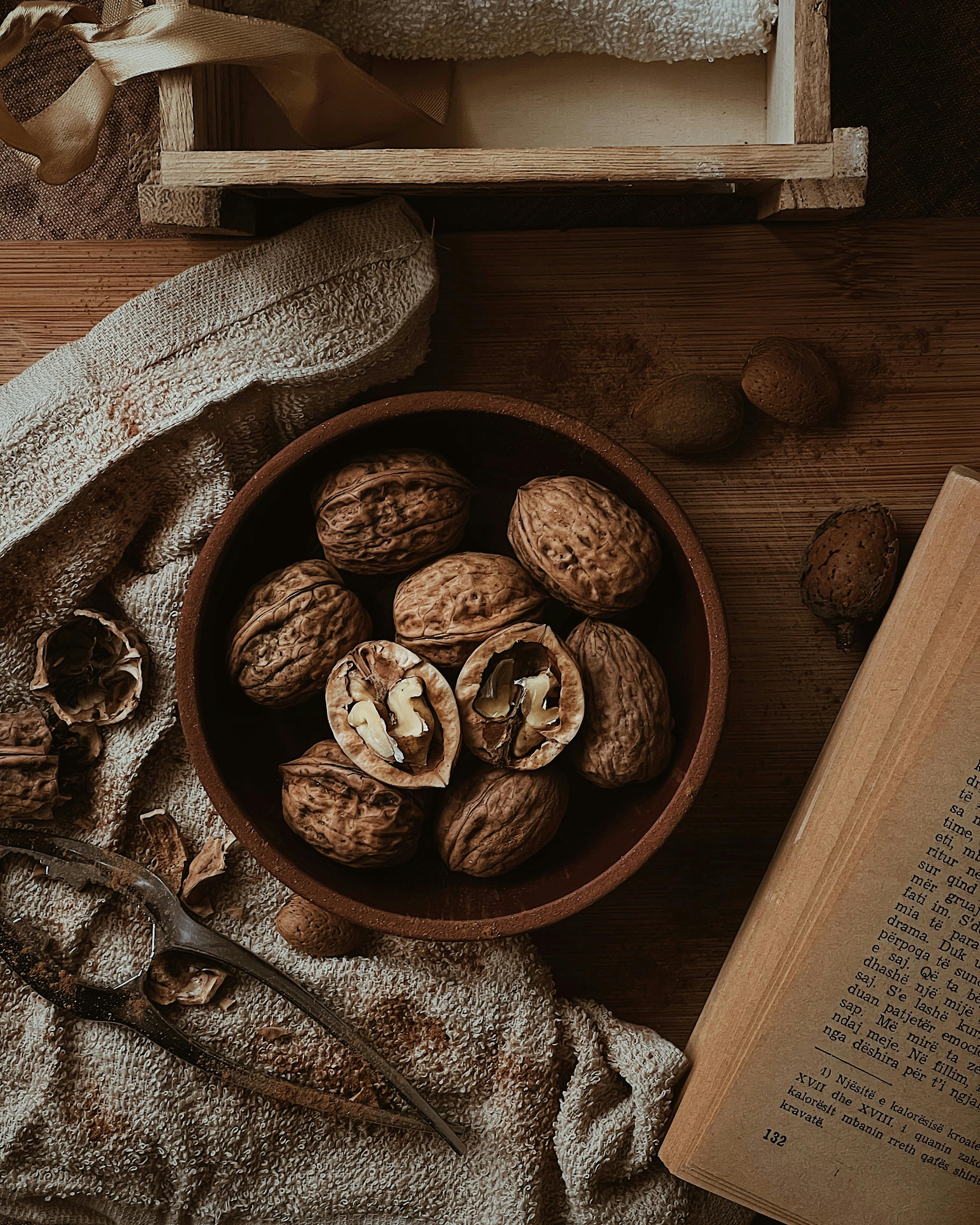 Bowl of Walnuts by Old Book · Free Stock Photo