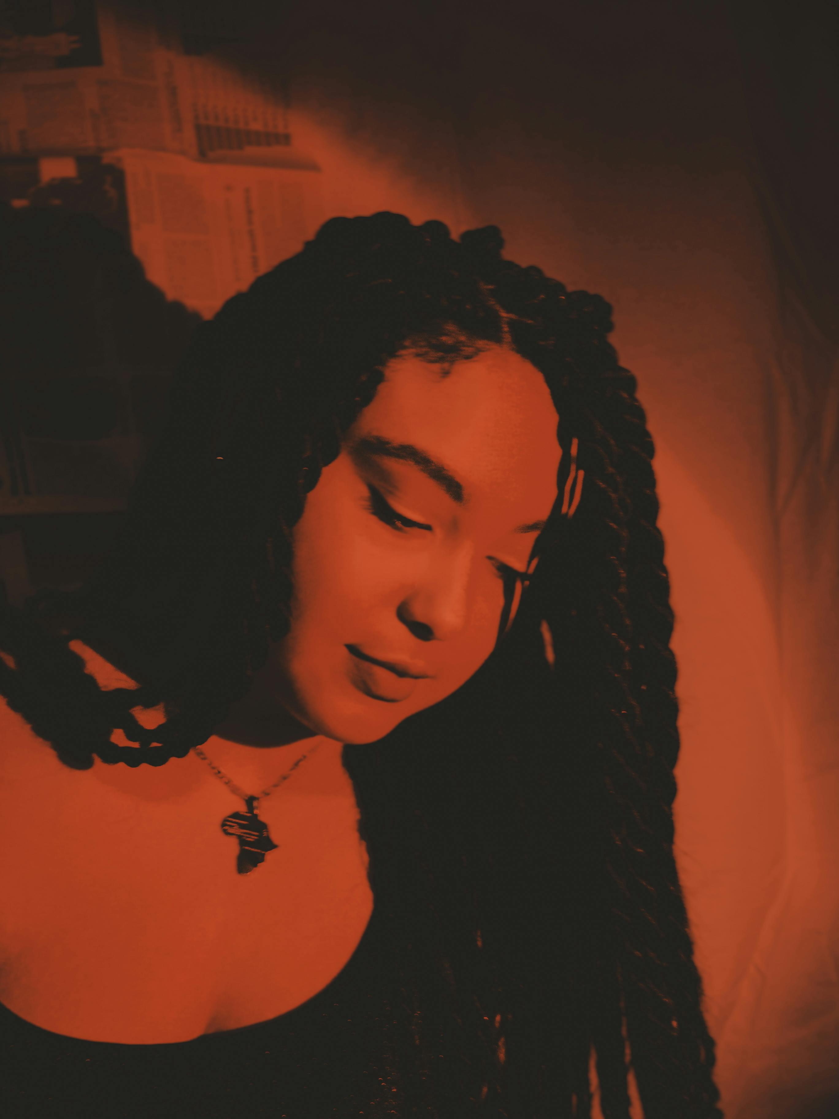 Portrait of a Young Woman in Red Lighting · Free Stock Photo