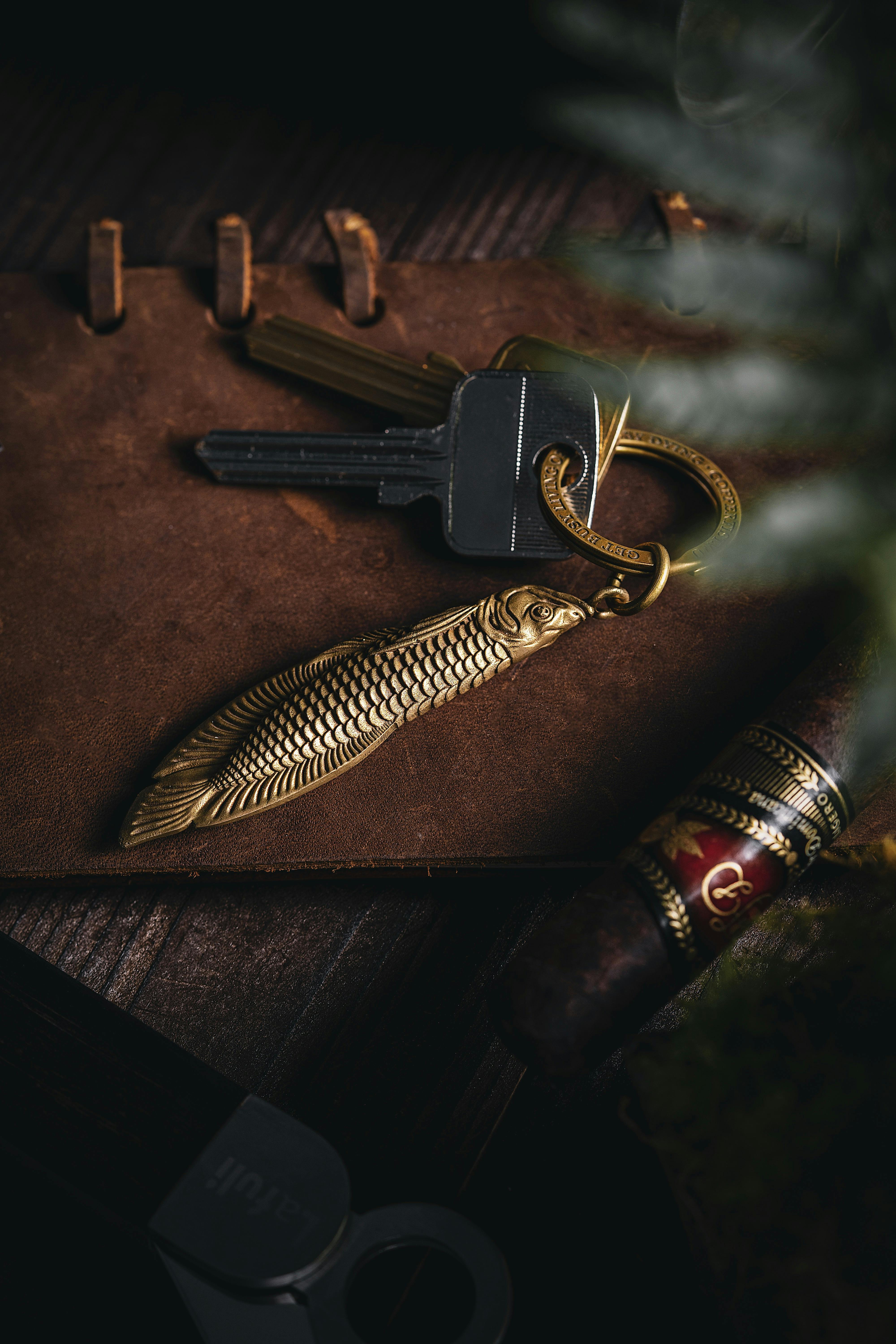 Silver Keys on Brown Wooden Surface · Free Stock Photo