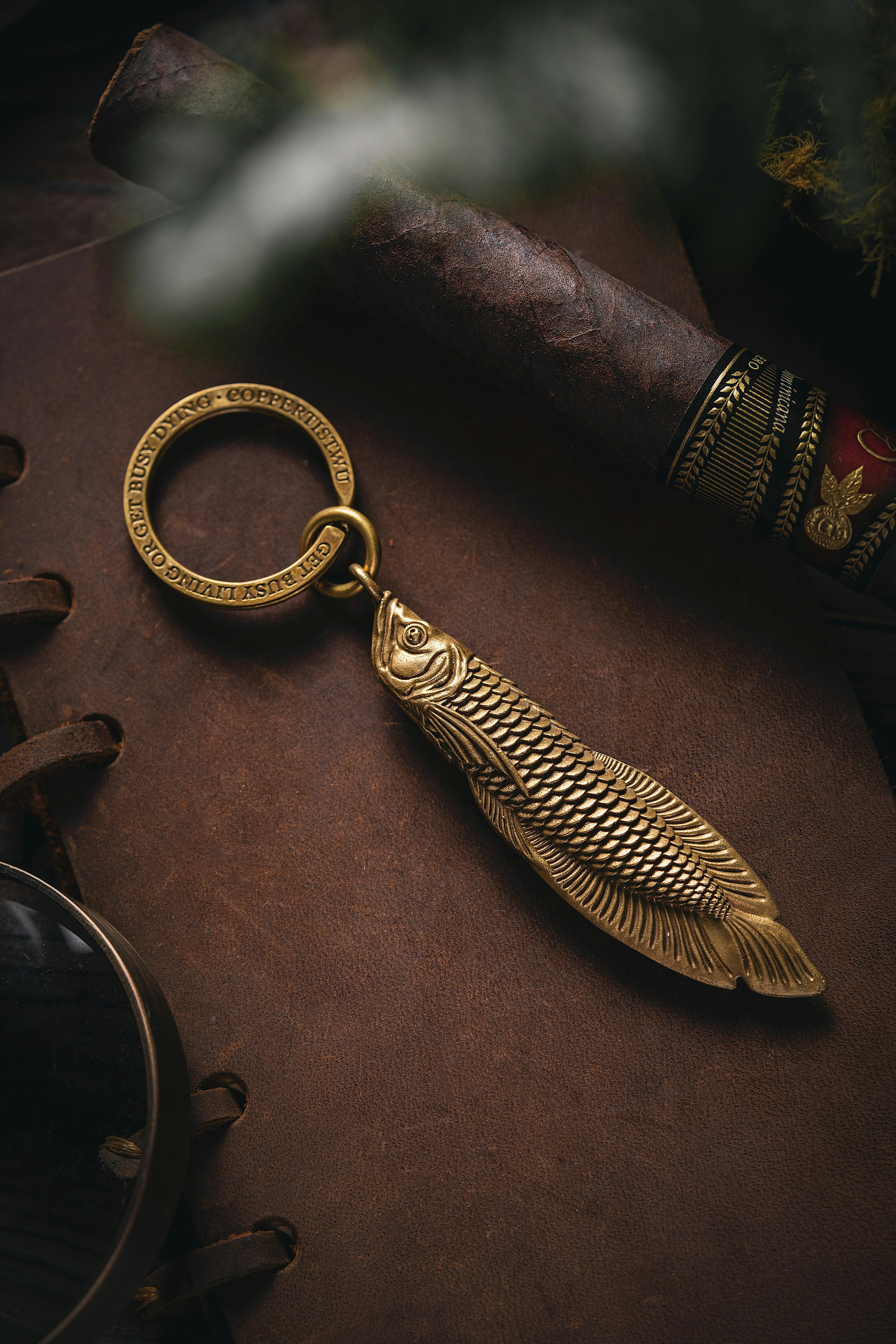 Golden Keychain with Fish · Free Stock Photo