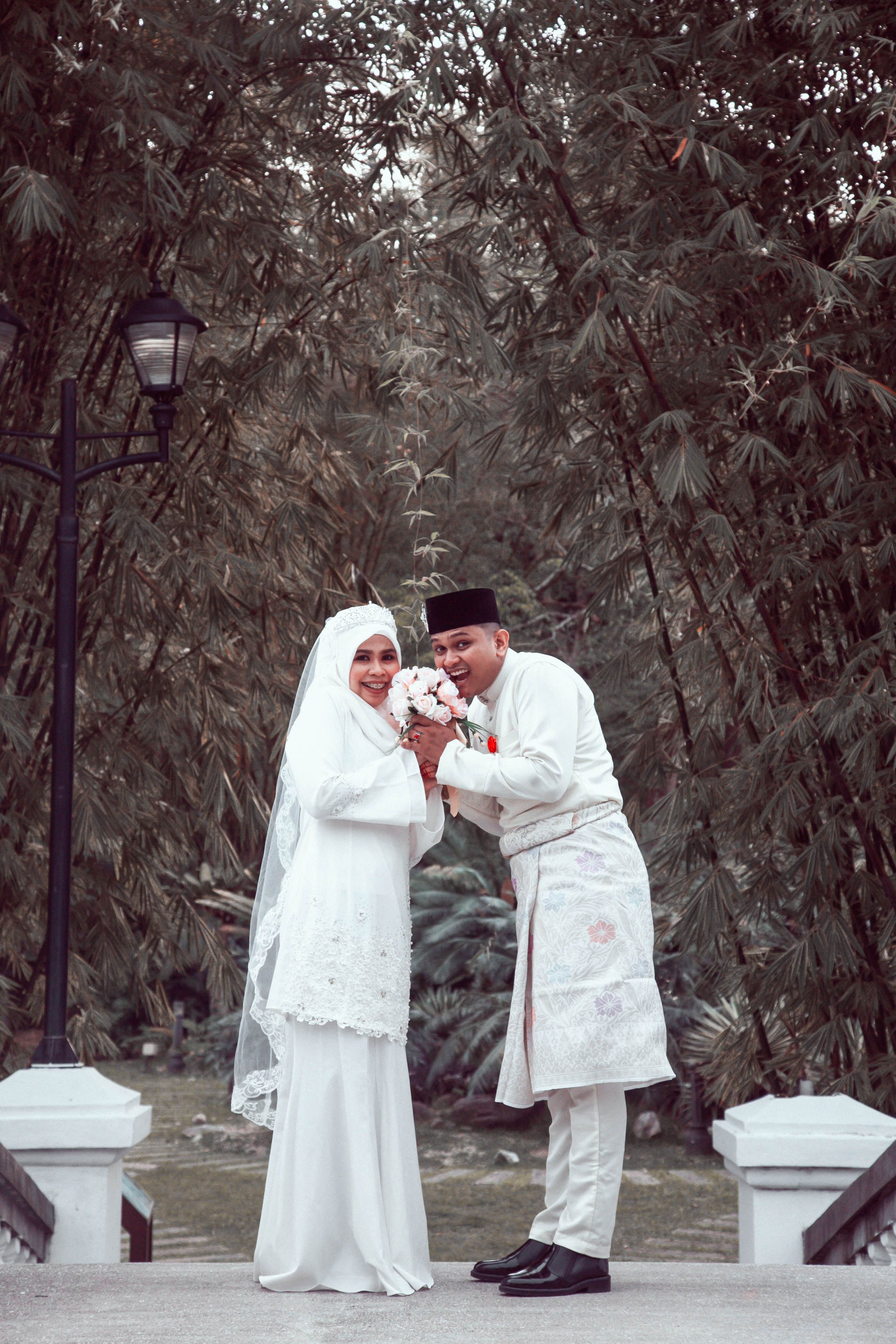 Woman and Man Posing in Traditional Wedding Clothing · Free Stock Photo