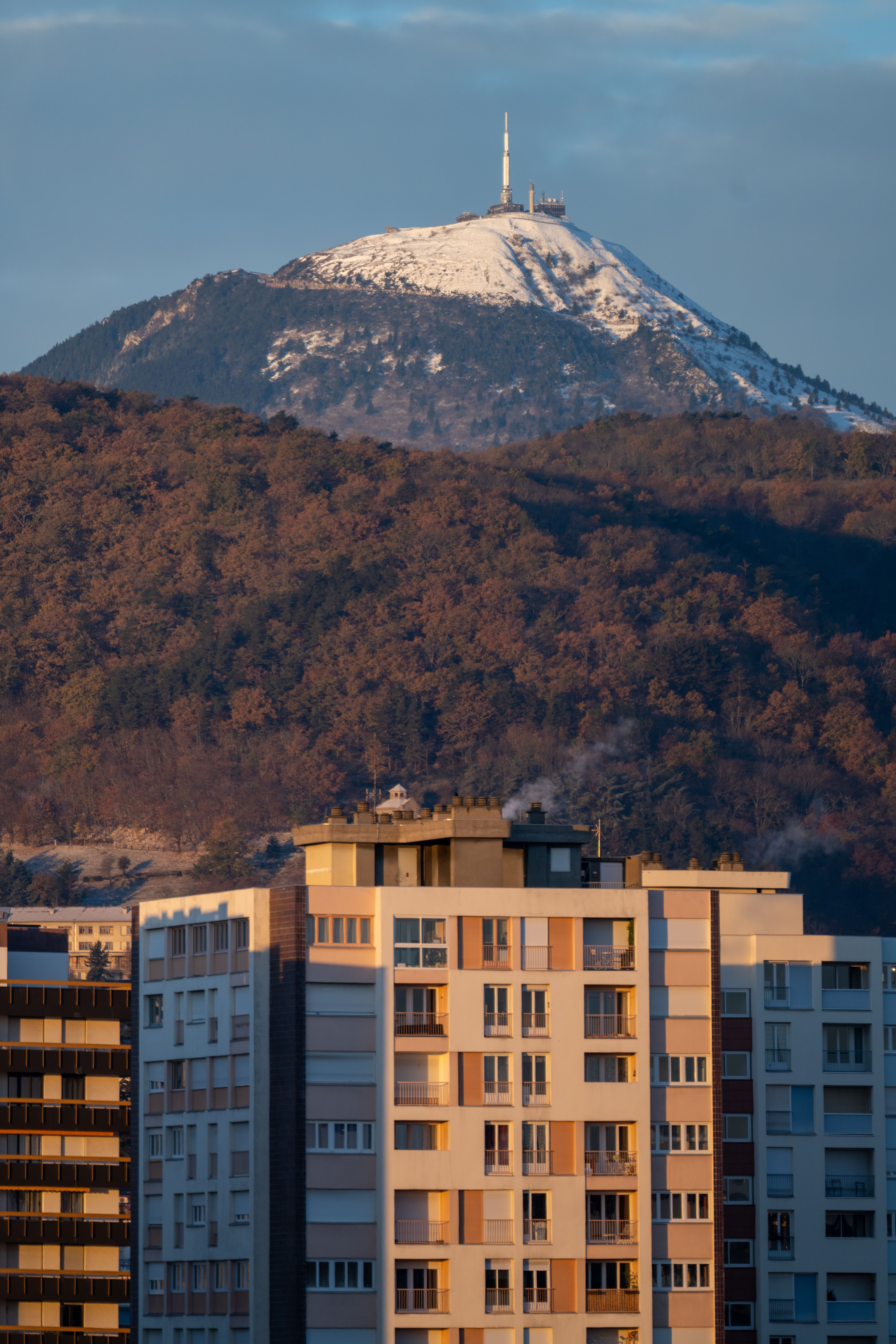 Mountain and Forest behind Building in Town · Free Stock Photo
