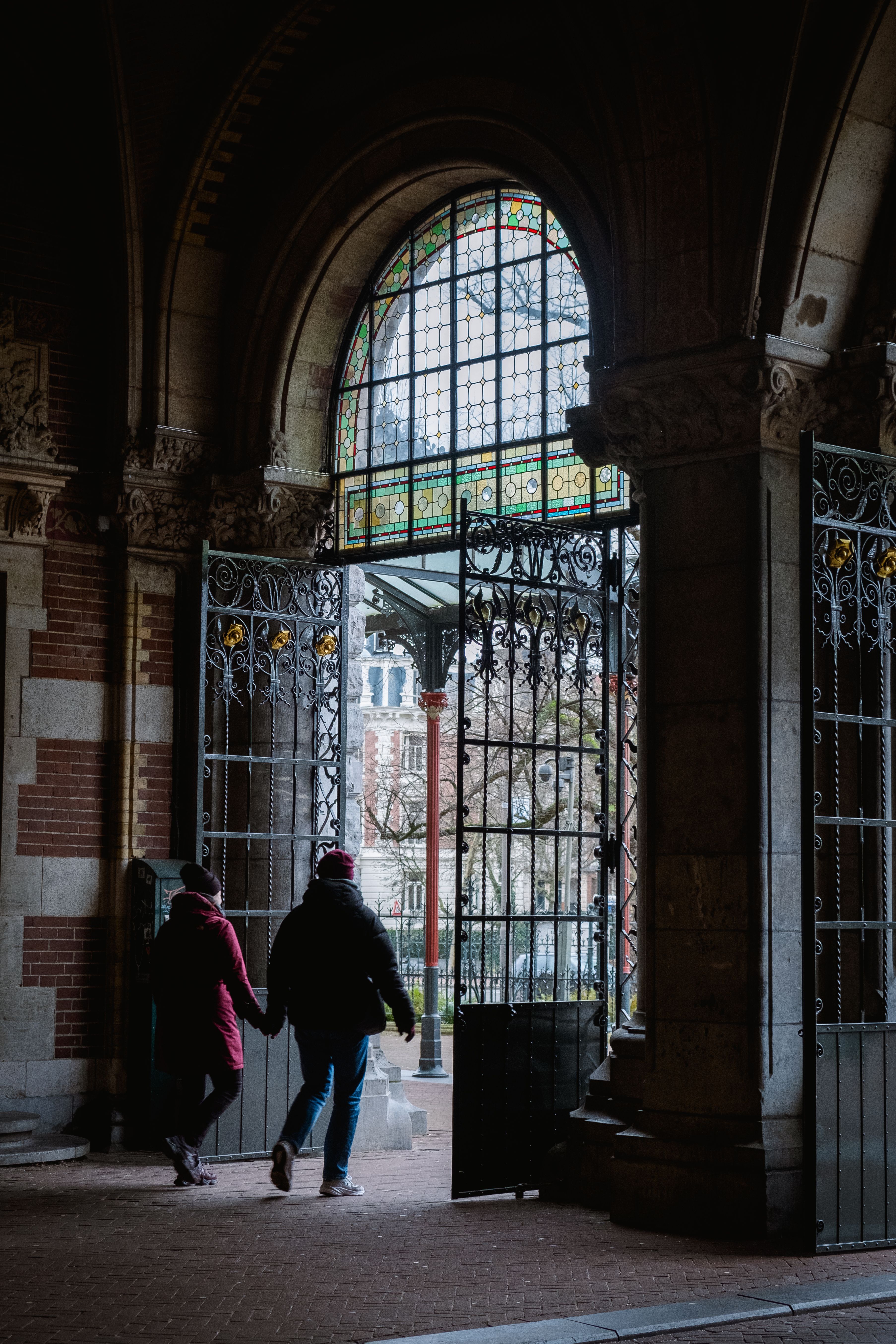 People Leaving through Gate · Free Stock Photo