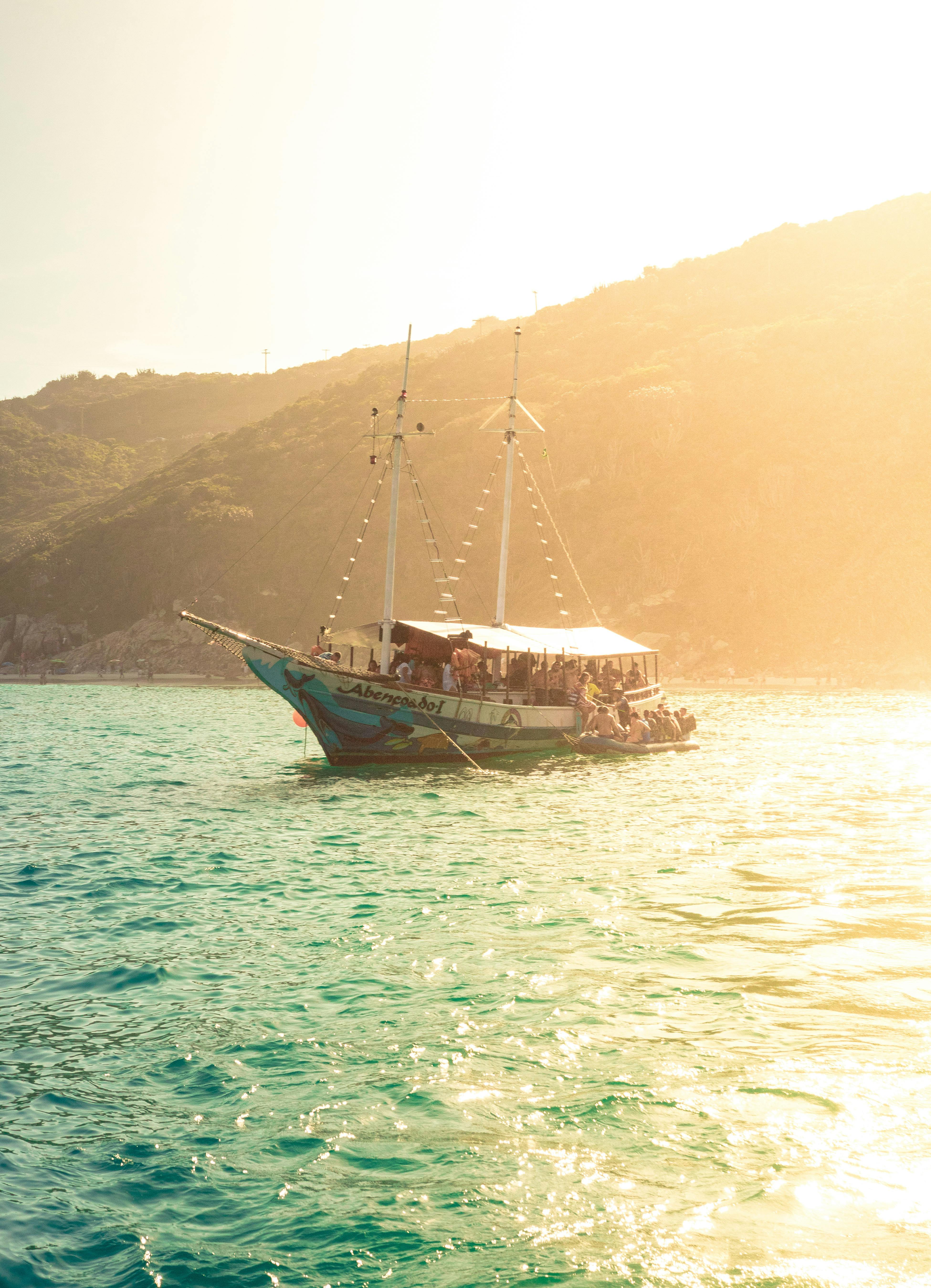 Man Standing On Wooden Boat · Free Stock Photo