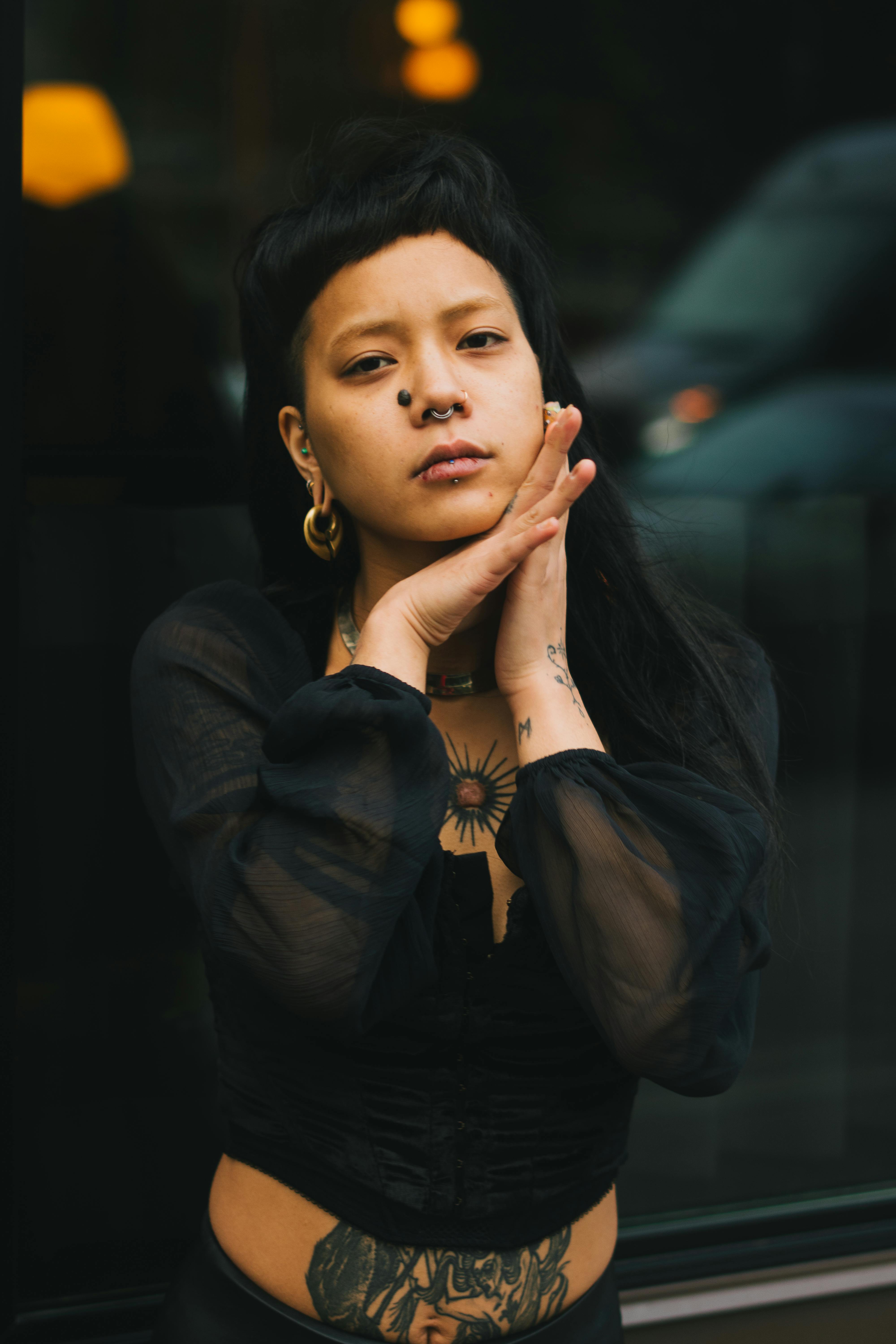 An Alternatively Dressed Woman with Tattoos · Free Stock Photo