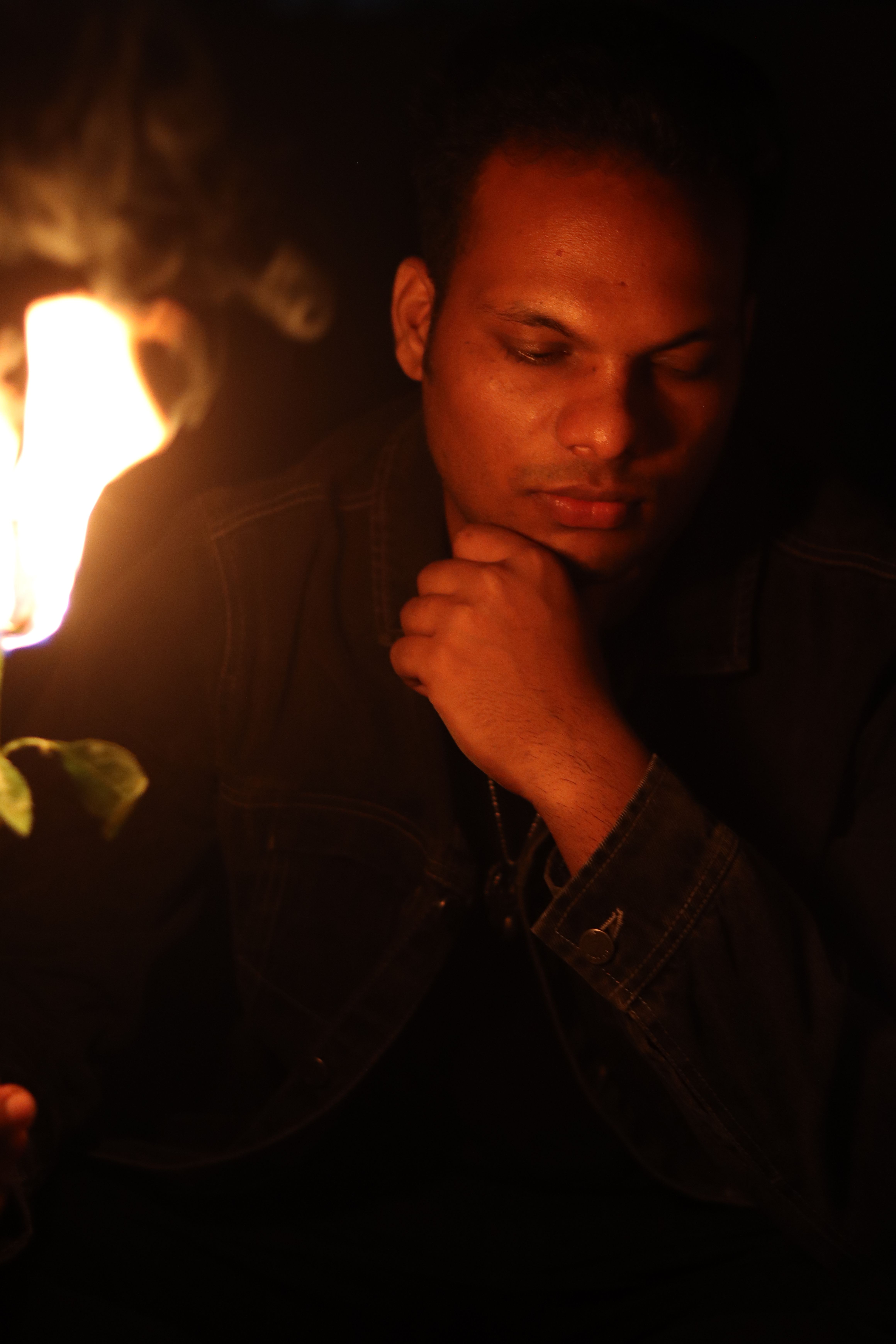Man with Hand on Chin in Candlelight · Free Stock Photo
