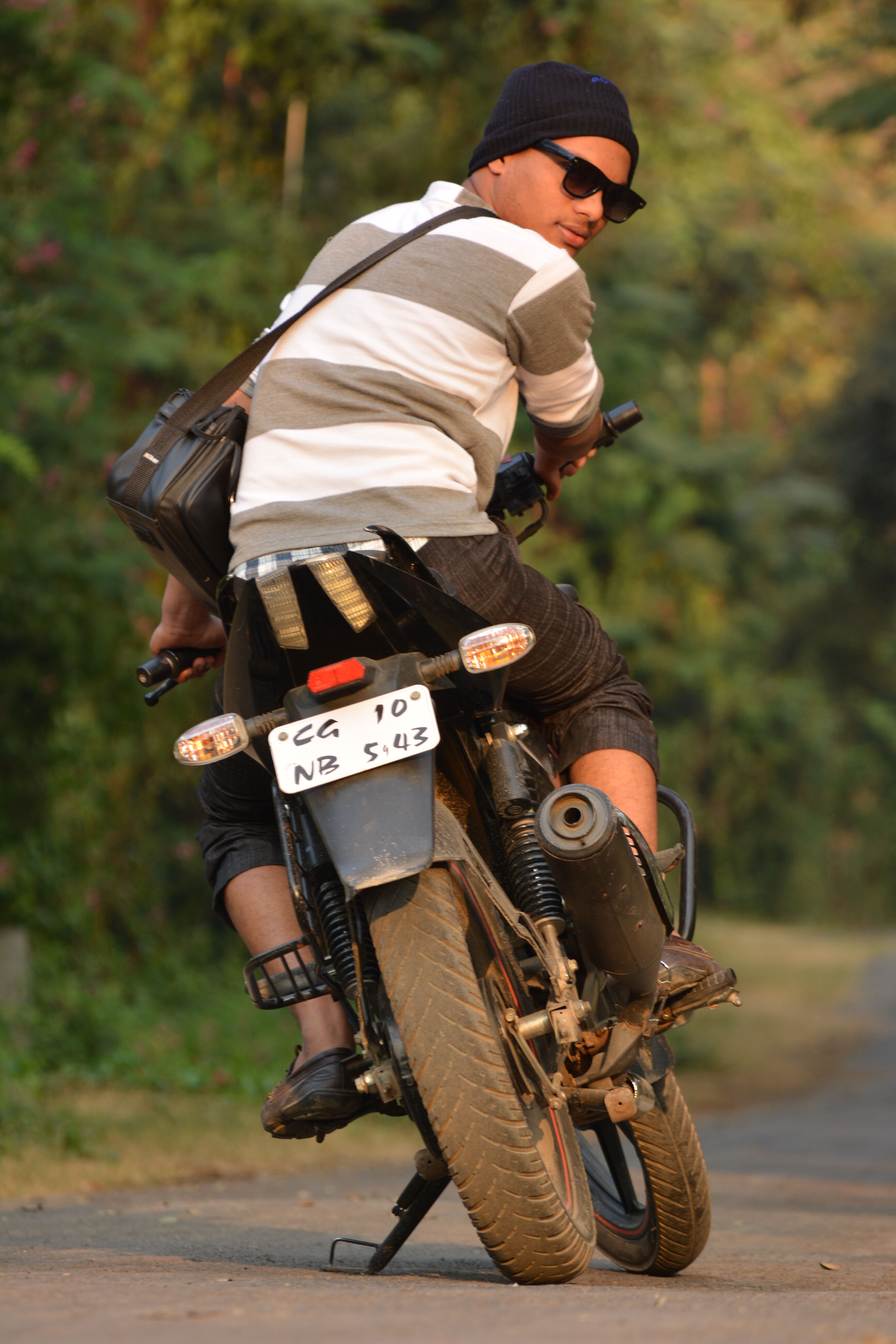 Back View of Man Sitting on Motorbike · Free Stock Photo