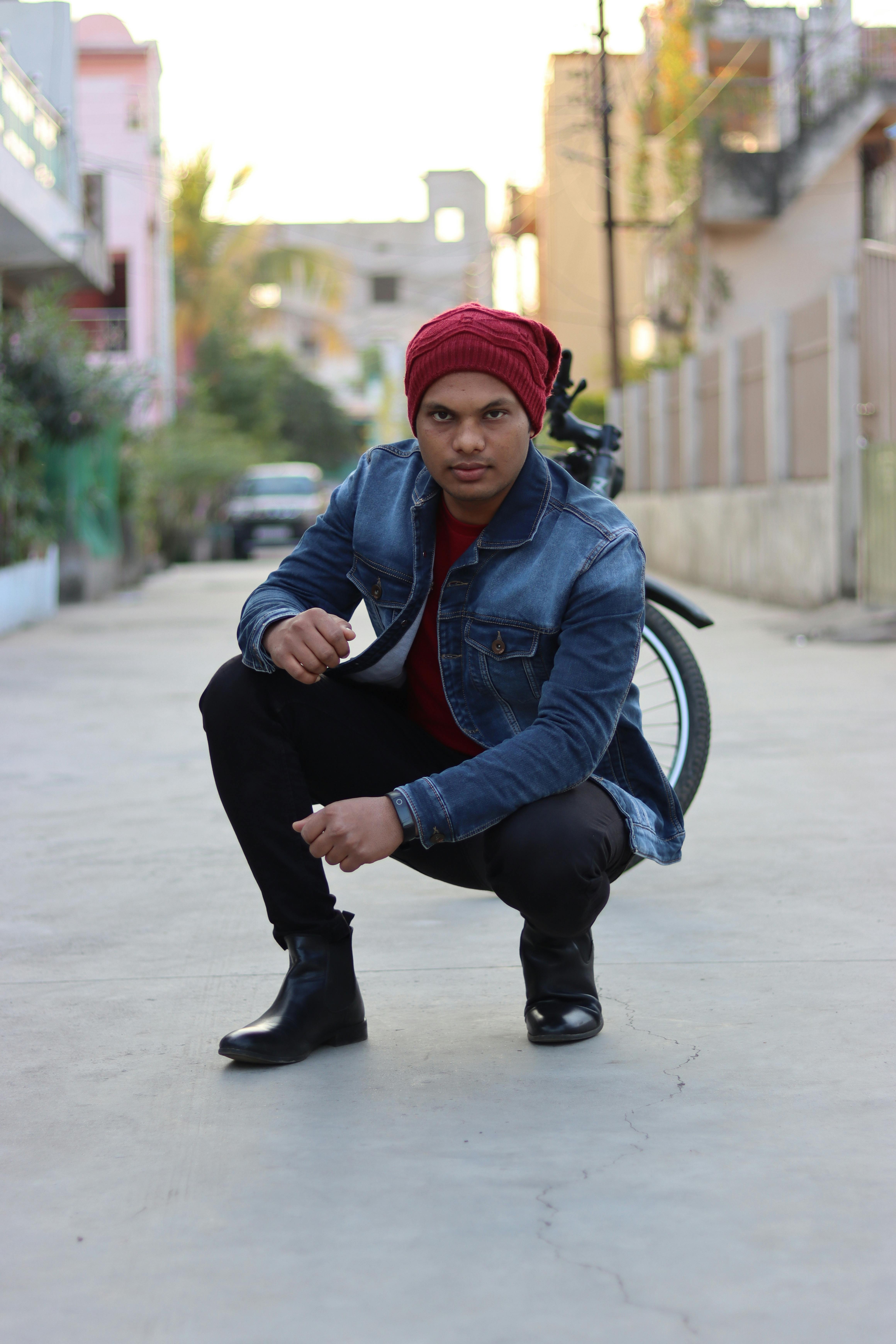 Portrait of a Man Crouching · Free Stock Photo