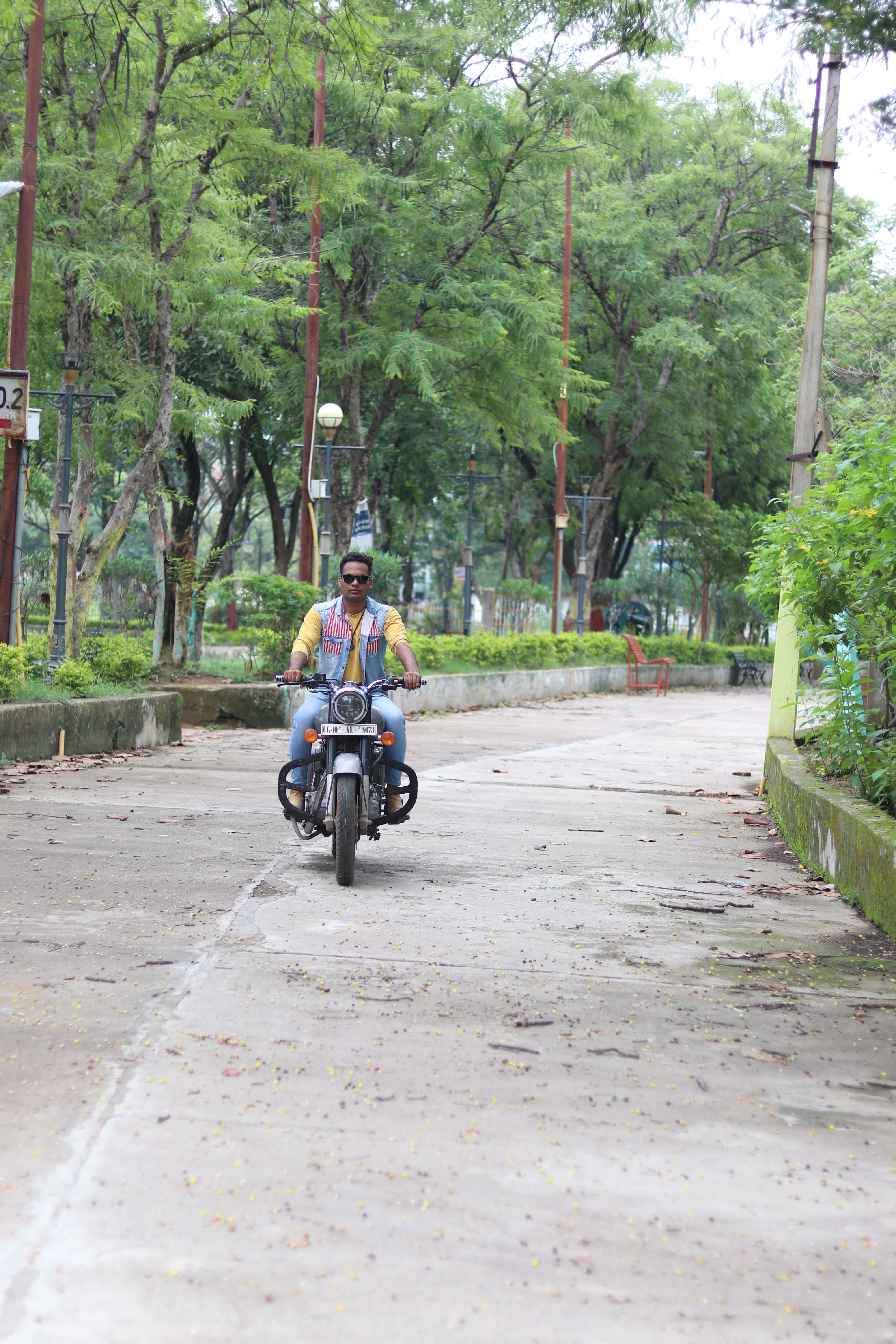 Man Driving Motorcycle through Concrete Road · Free Stock Photo