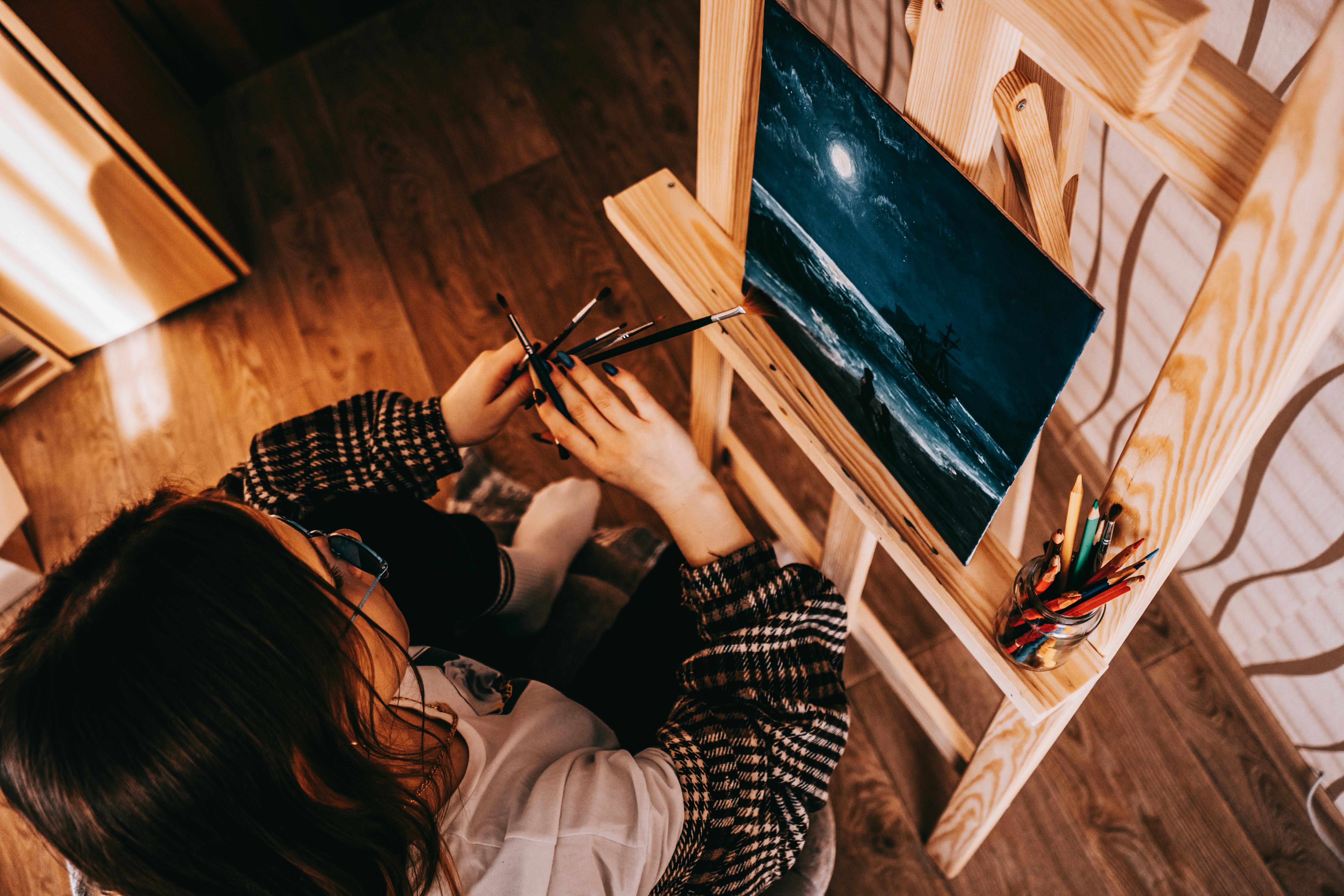 Artist Working on Painting · Free Stock Photo