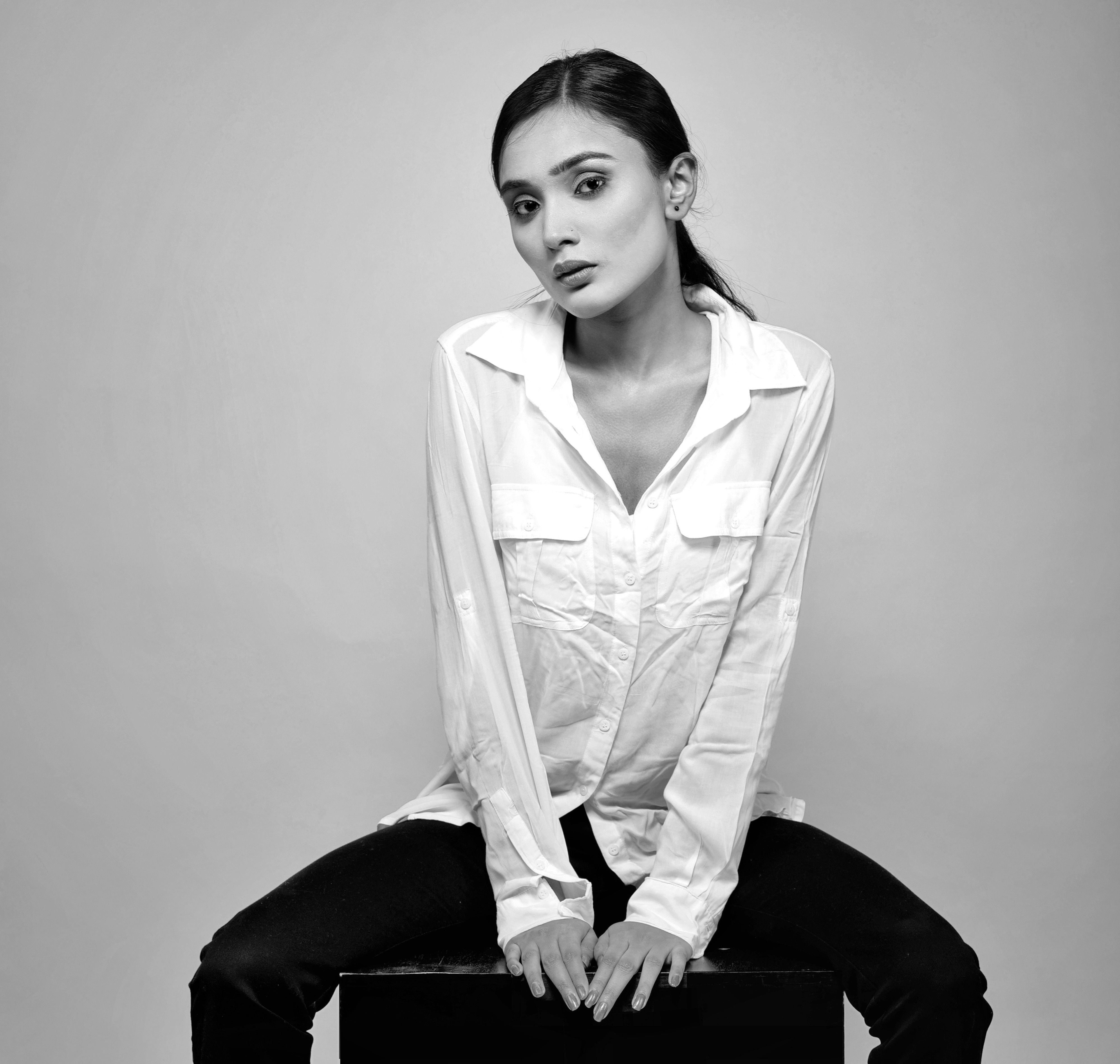 Woman Sitting in Studio · Free Stock Photo