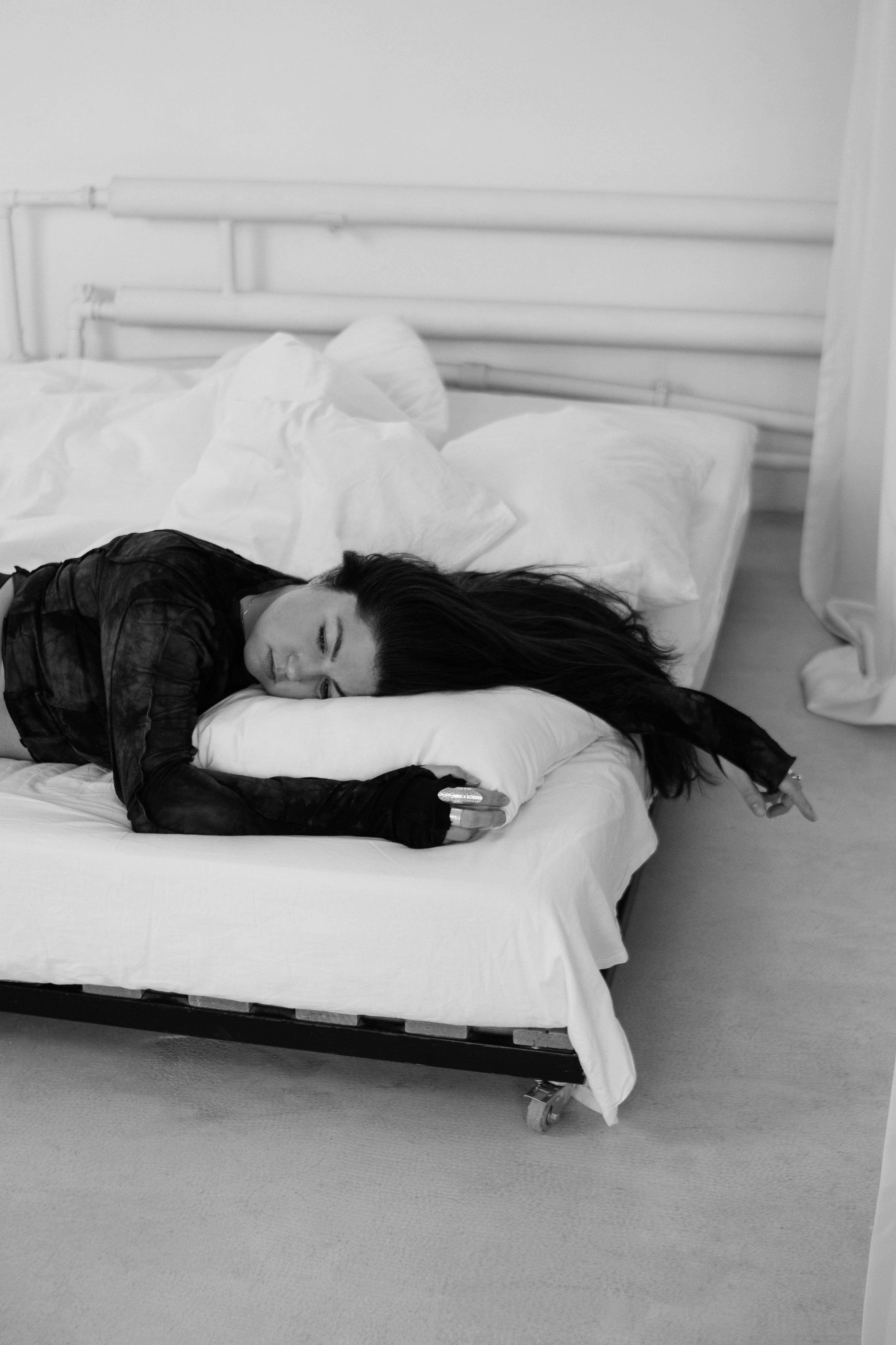 Elbow of a Woman Lying on a Bed · Free Stock Photo