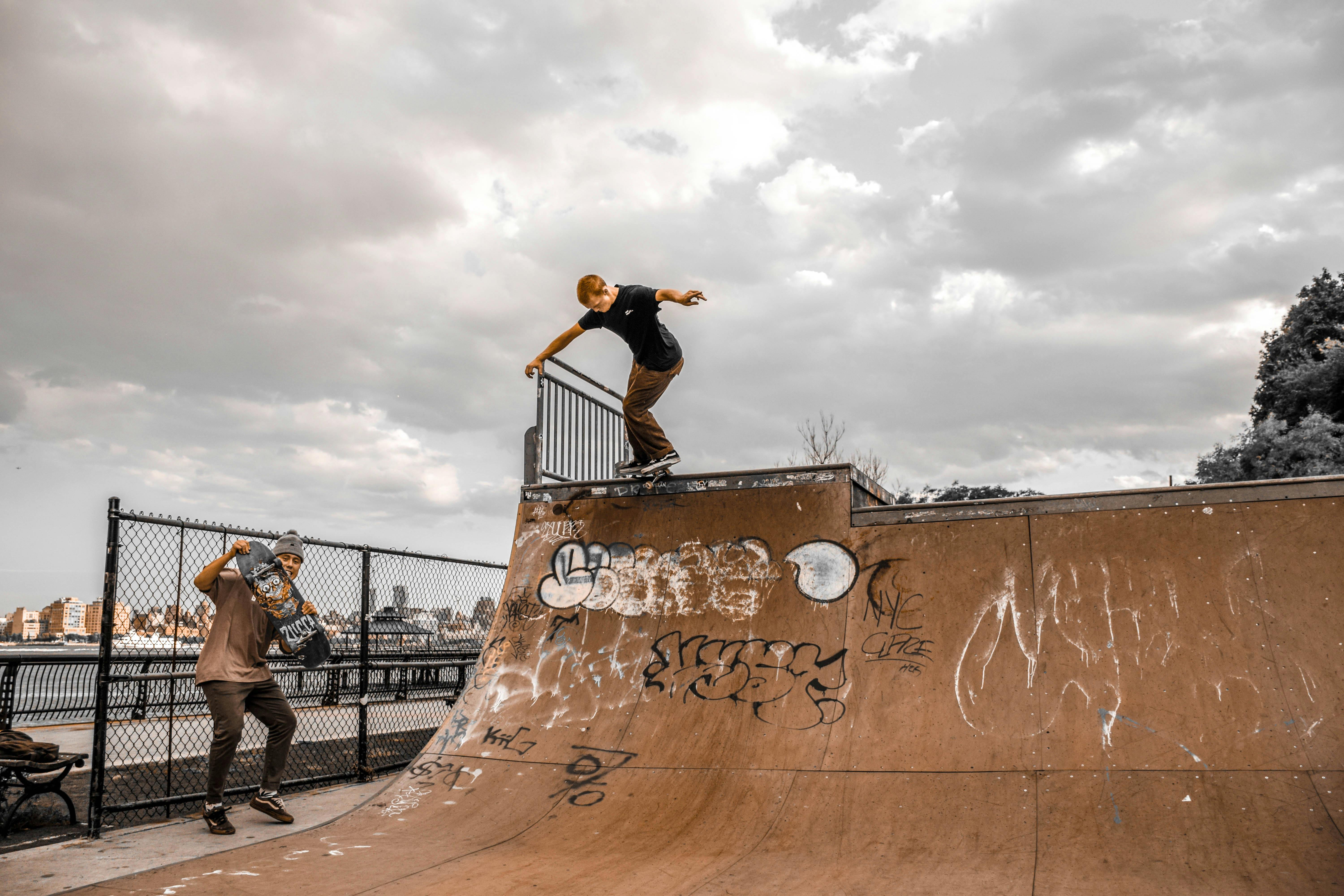 Skater on Edge of Skate Ramp · Free Stock Photo