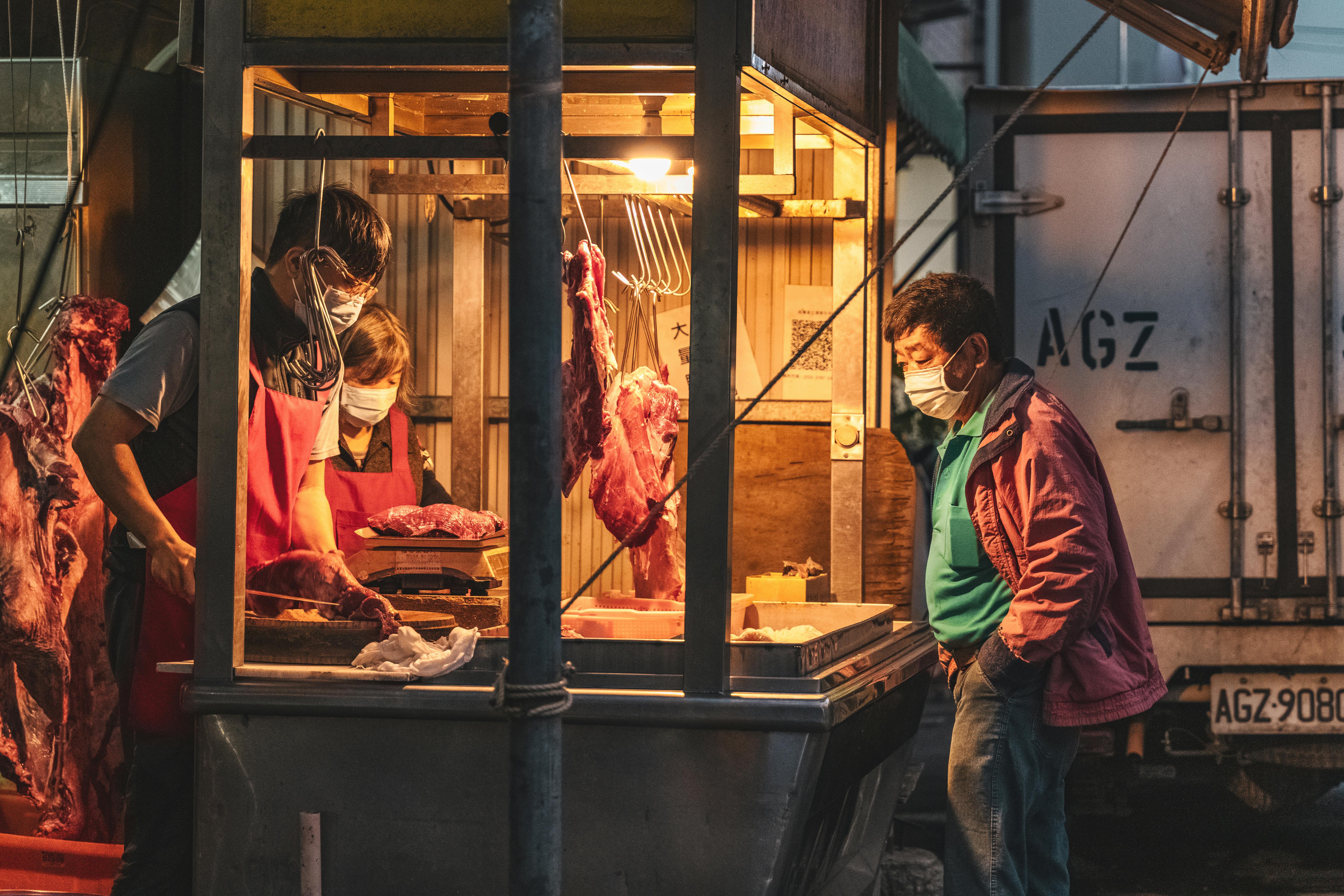 People Standing by Booth with Meat · Free Stock Photo