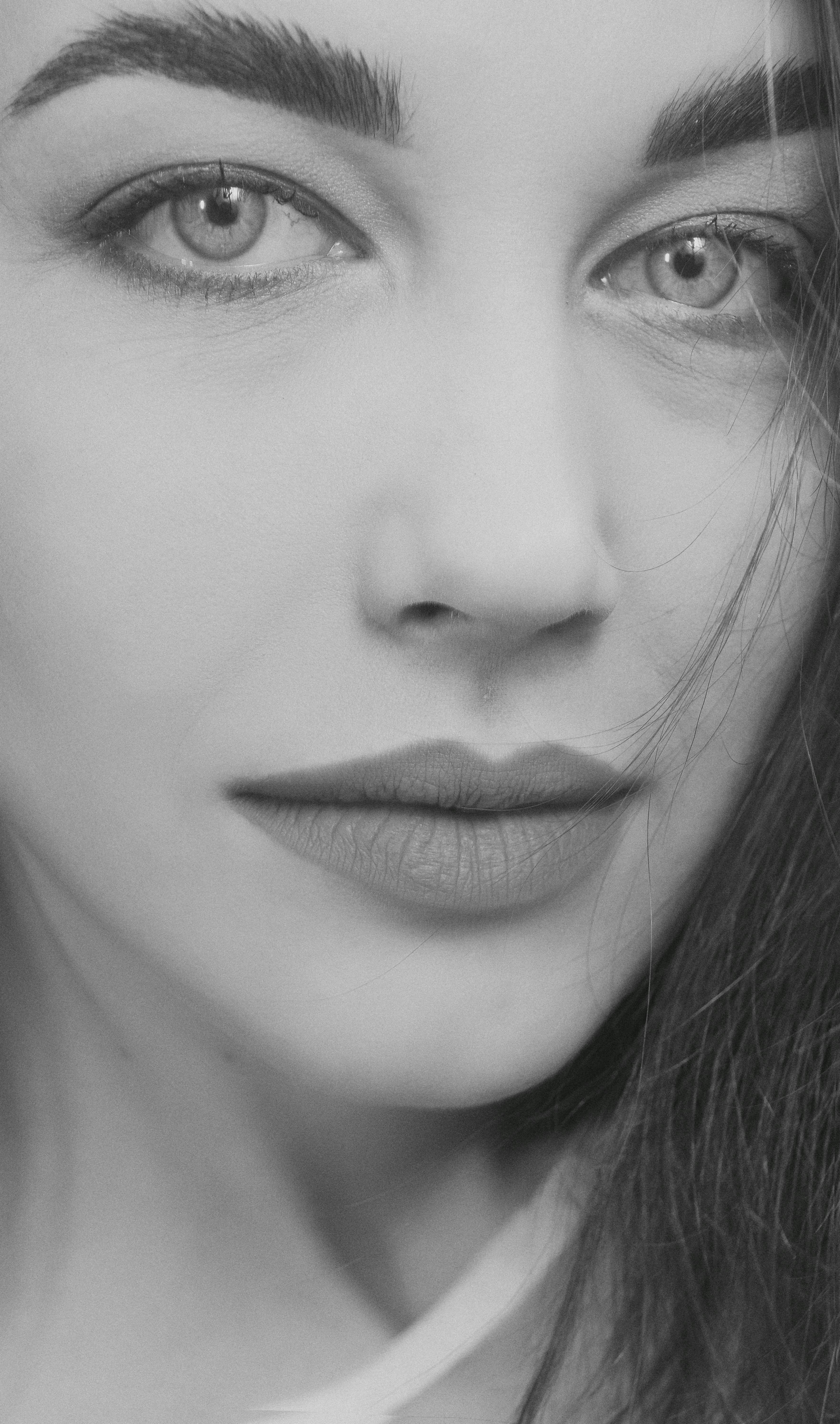 Black and White Close-up Portrait of a Young Woman · Free Stock Photo