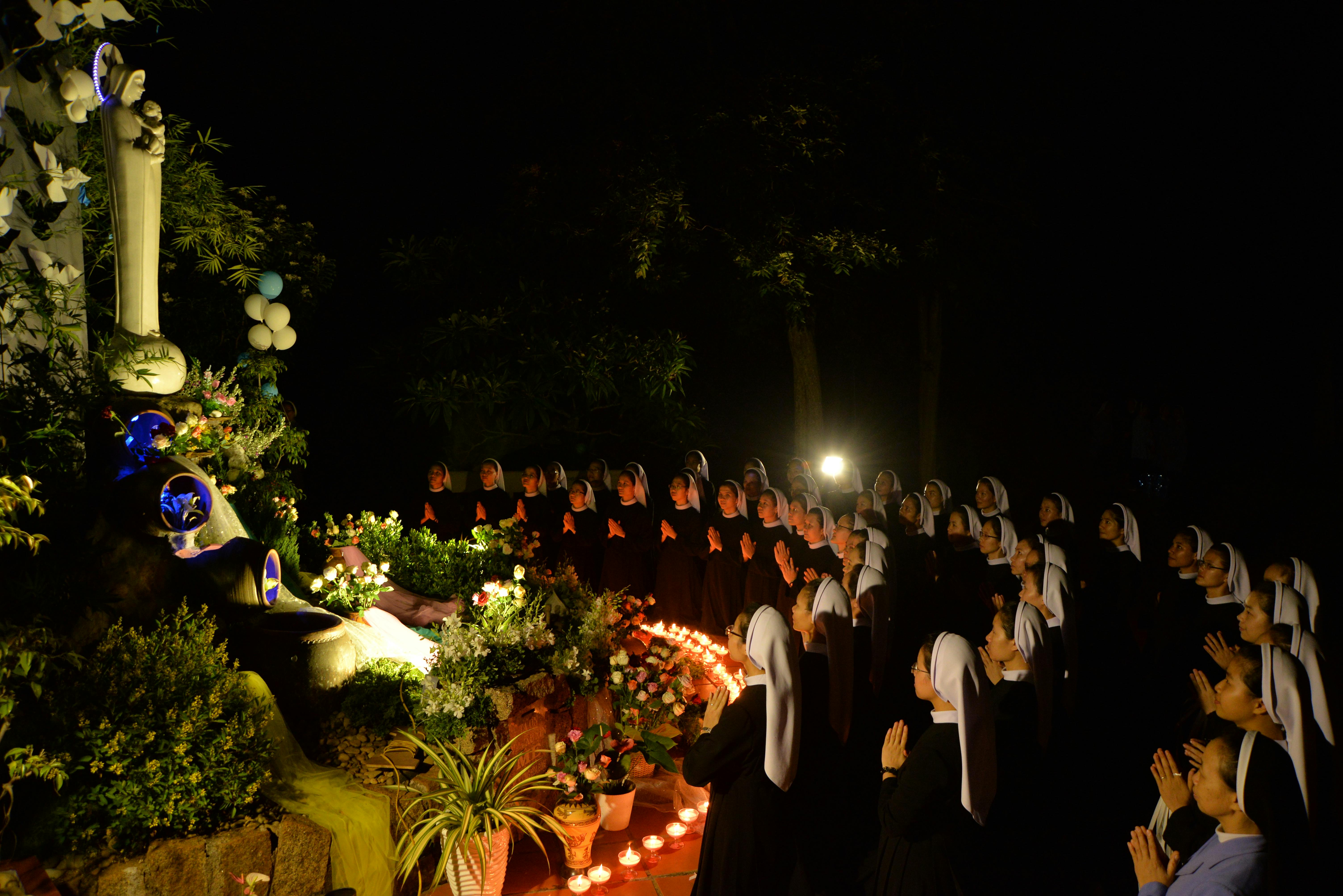 Nuns Praying by Altar at Night · Free Stock Photo