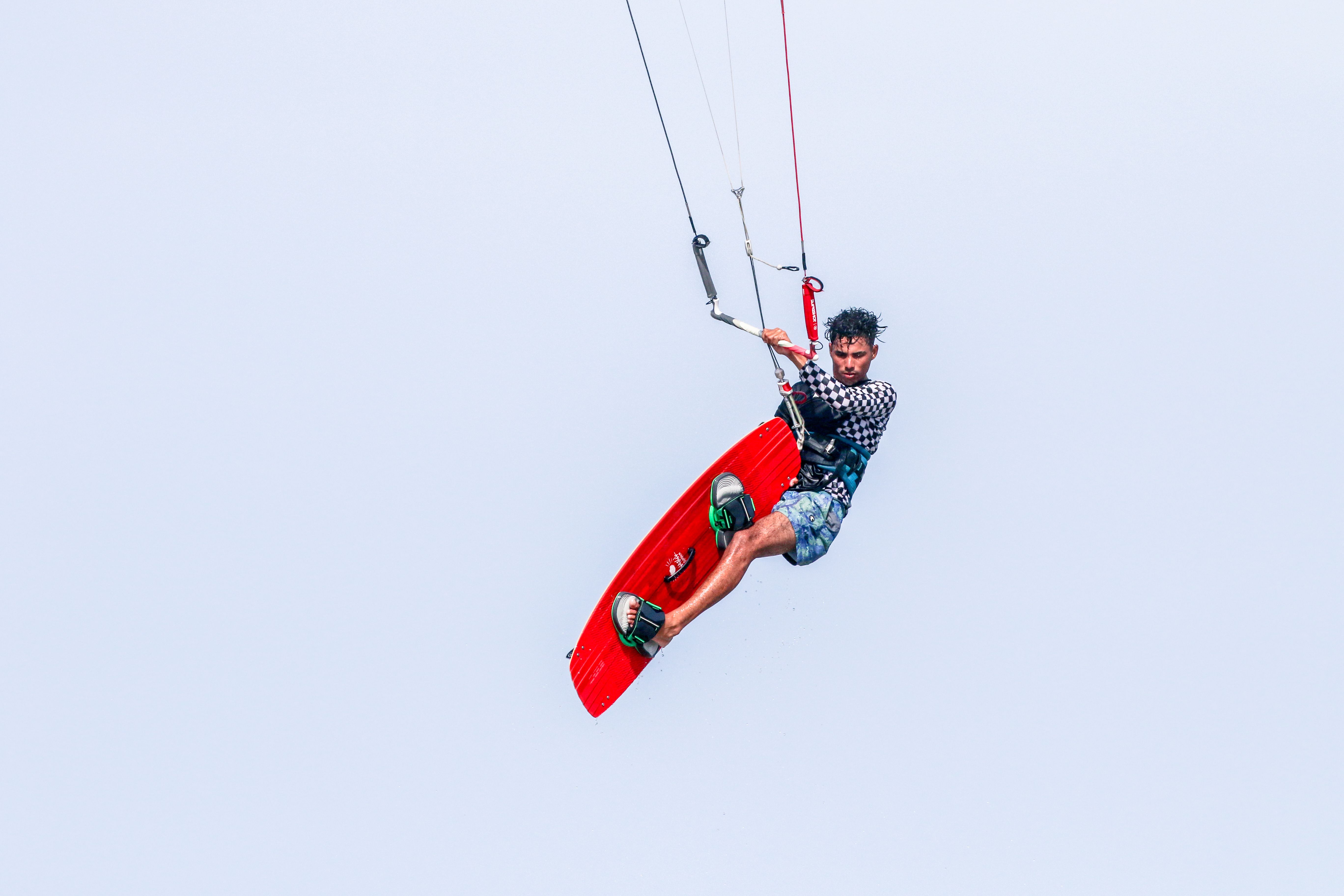 Man Flying above the Sea while Kitesurfing · Free Stock Photo