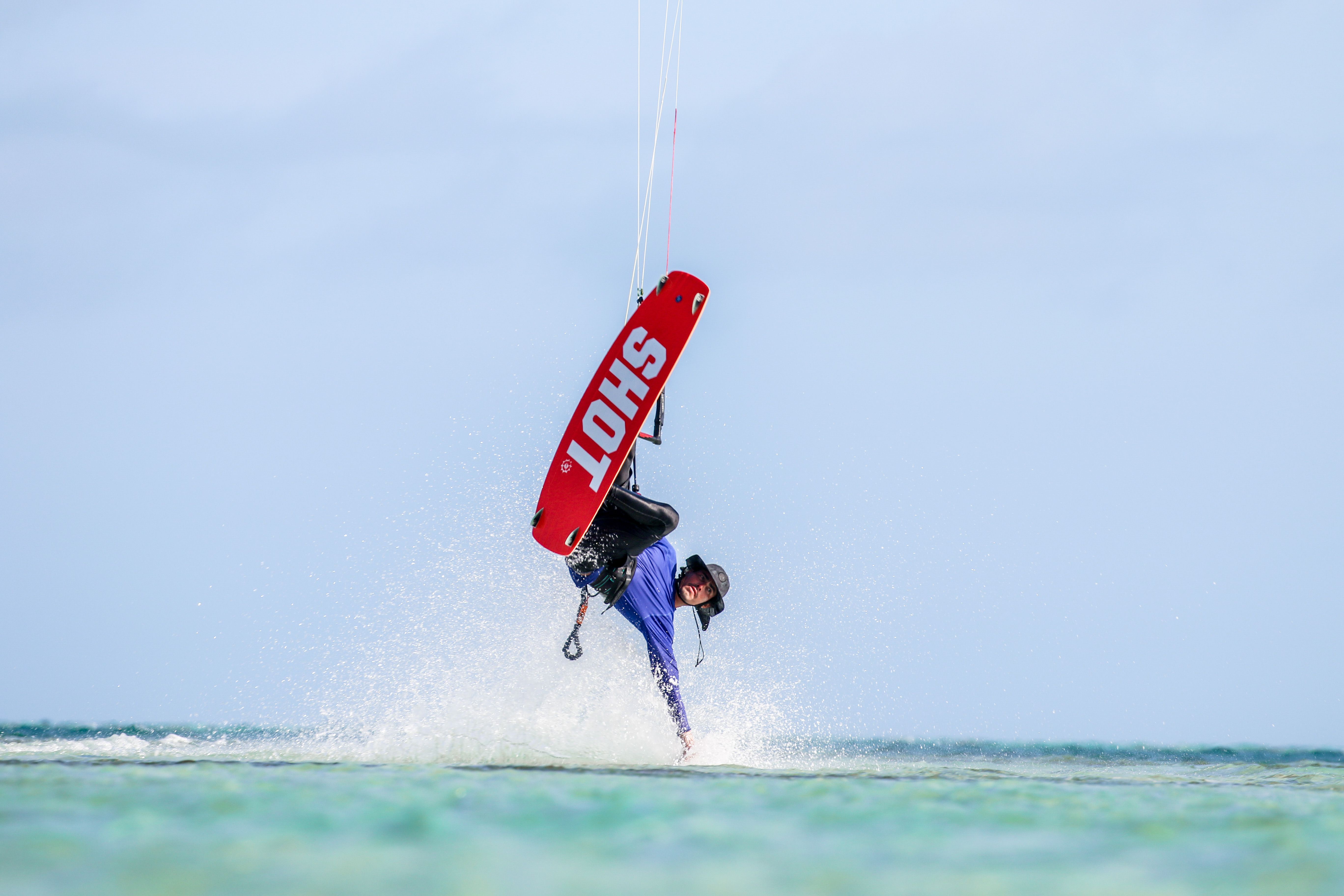Man Kitesurfing and Hovering over Sea · Free Stock Photo