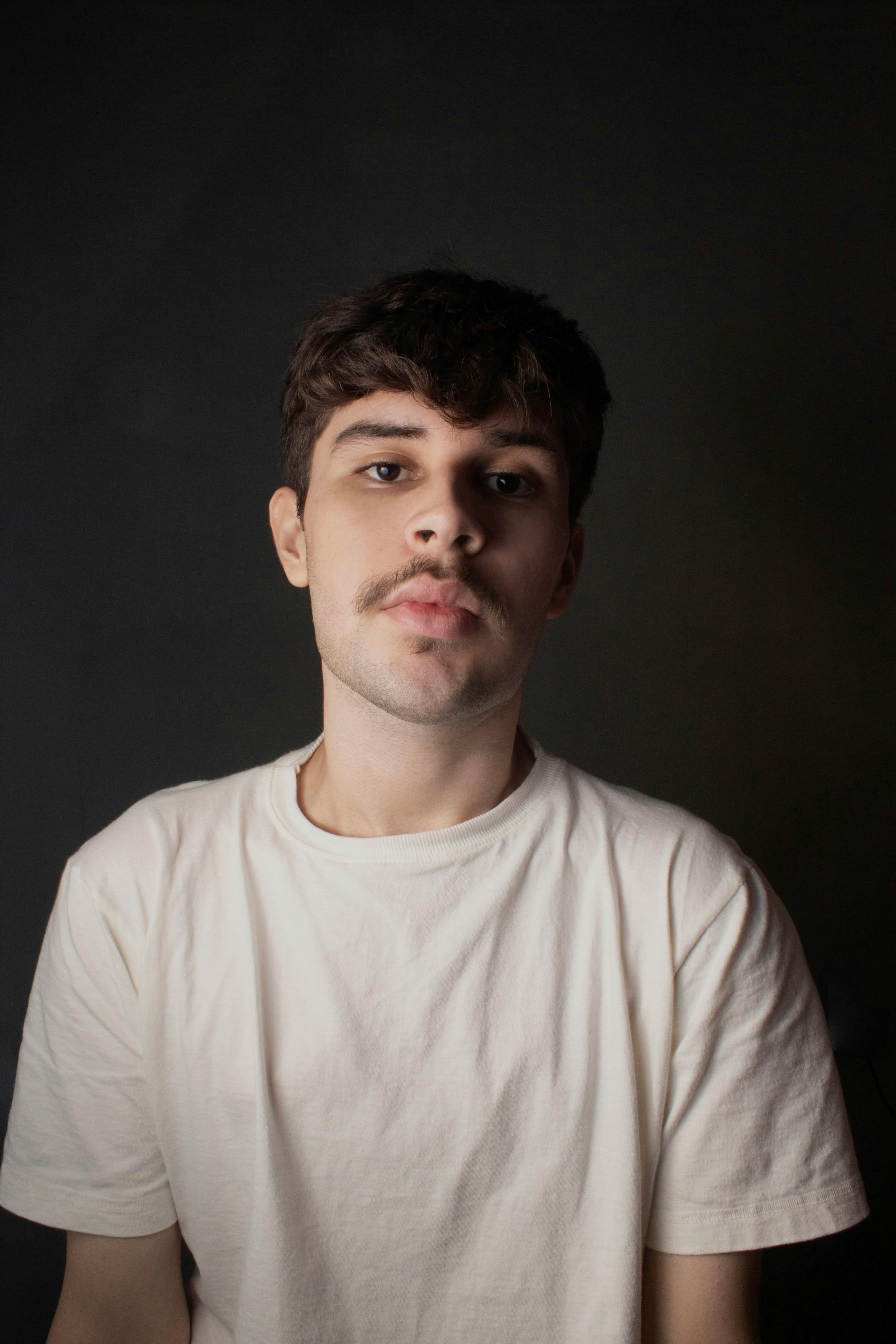 Portrait of a Young Man with Mustache · Free Stock Photo