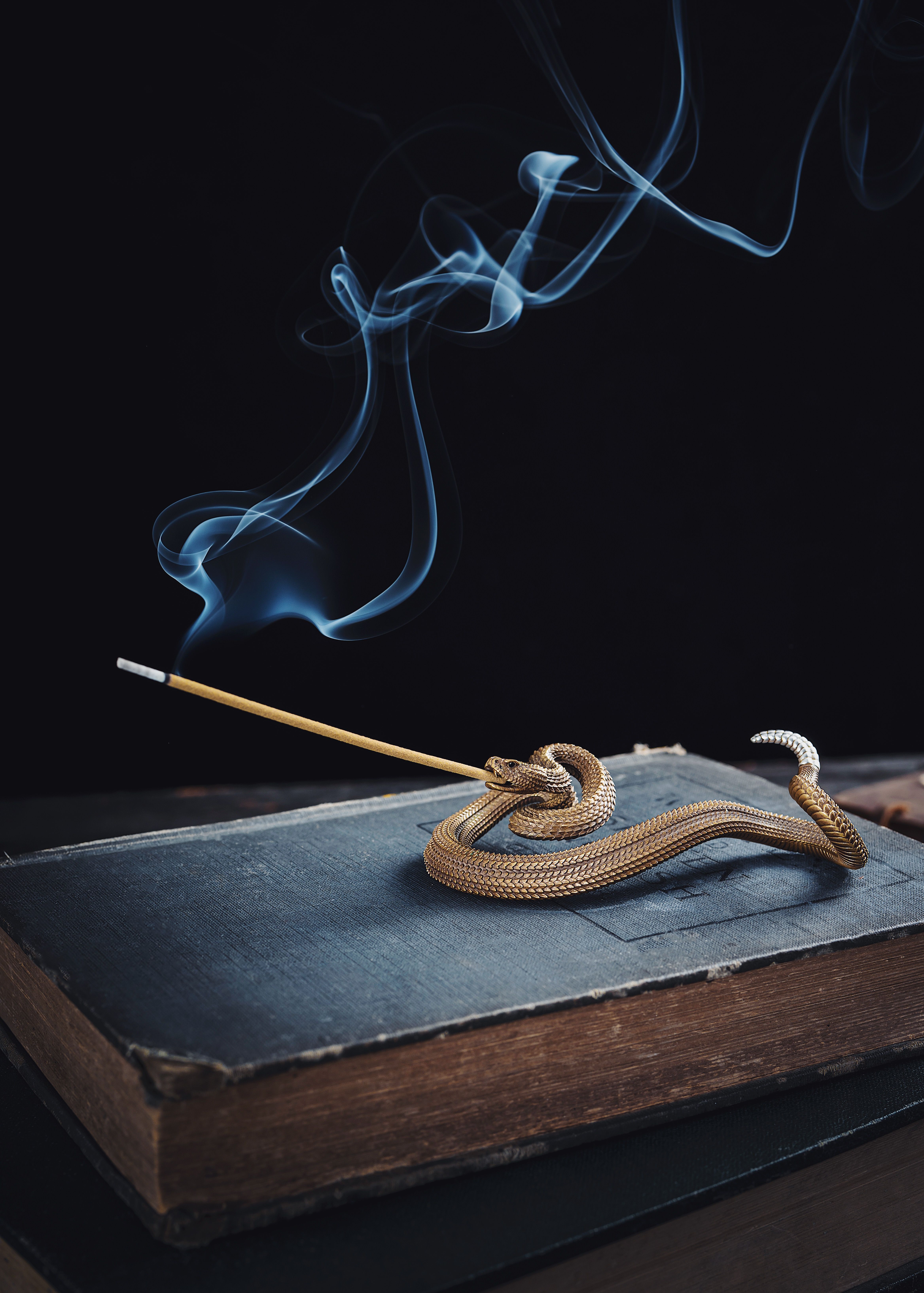 A Smoke Coming from a Burning Incense Sticks · Free Stock Photo