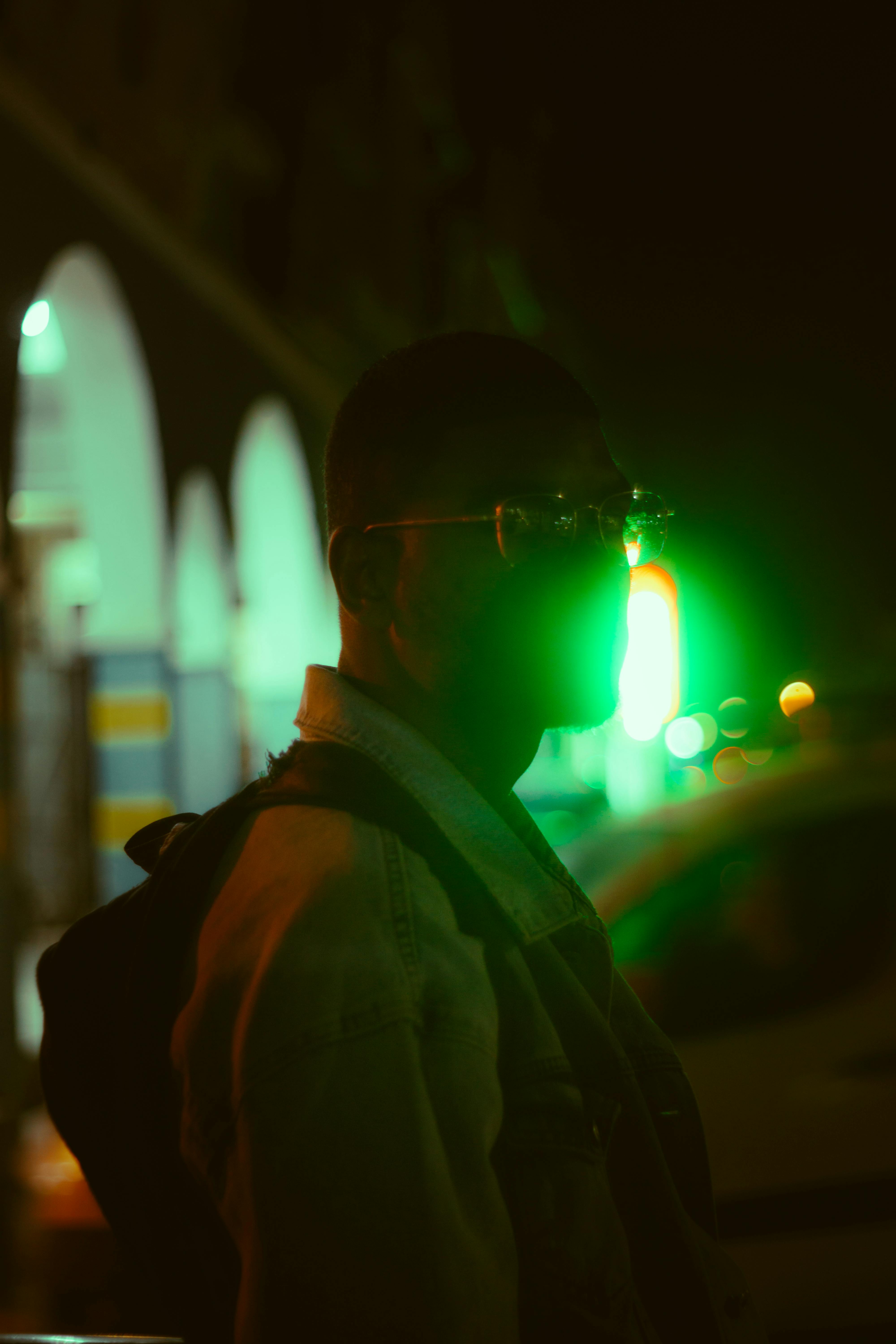 Green Light over Man at Night · Free Stock Photo