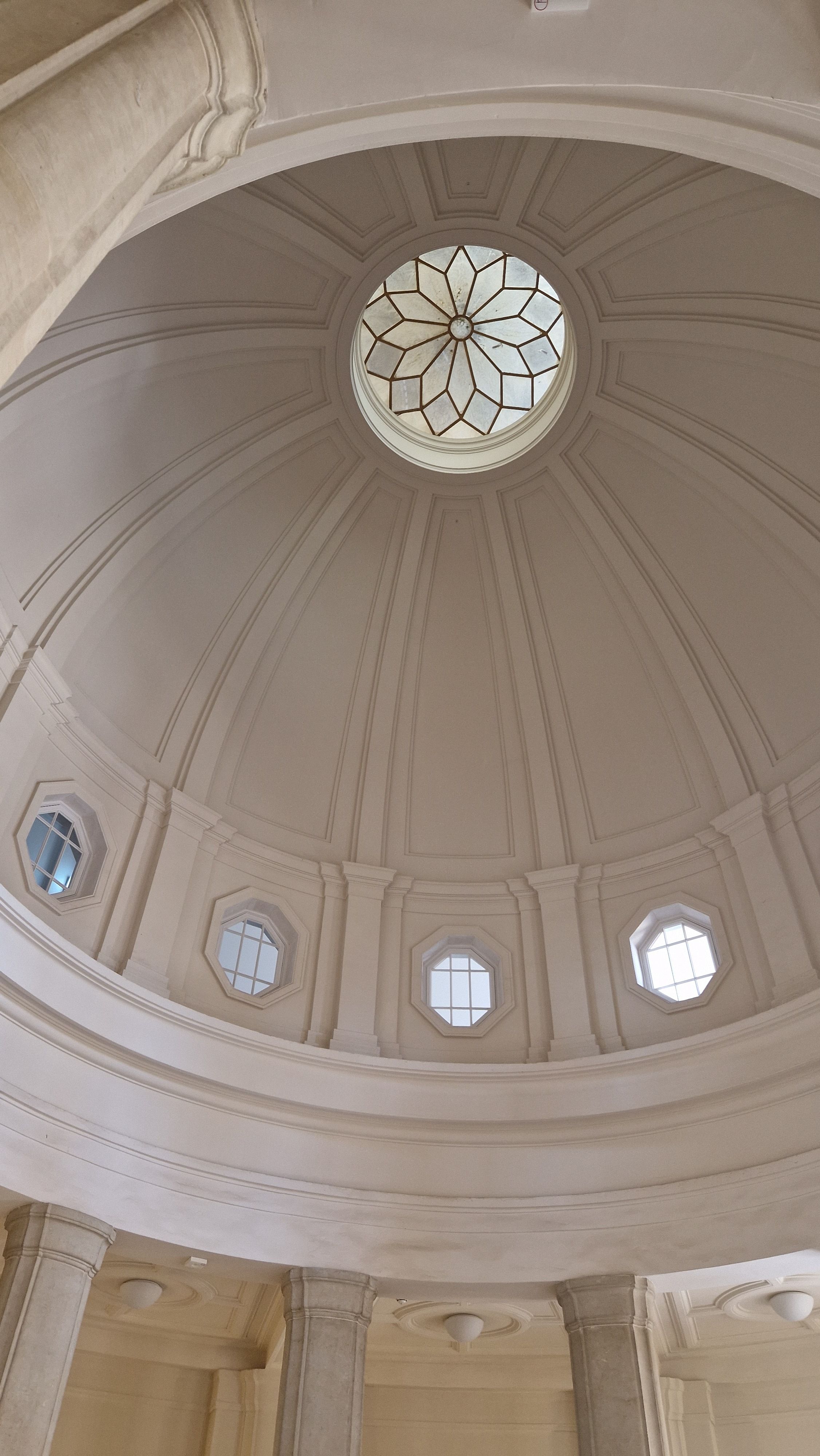 View of Interior of a Dome with a Circular Window with a Floral Pattern ...