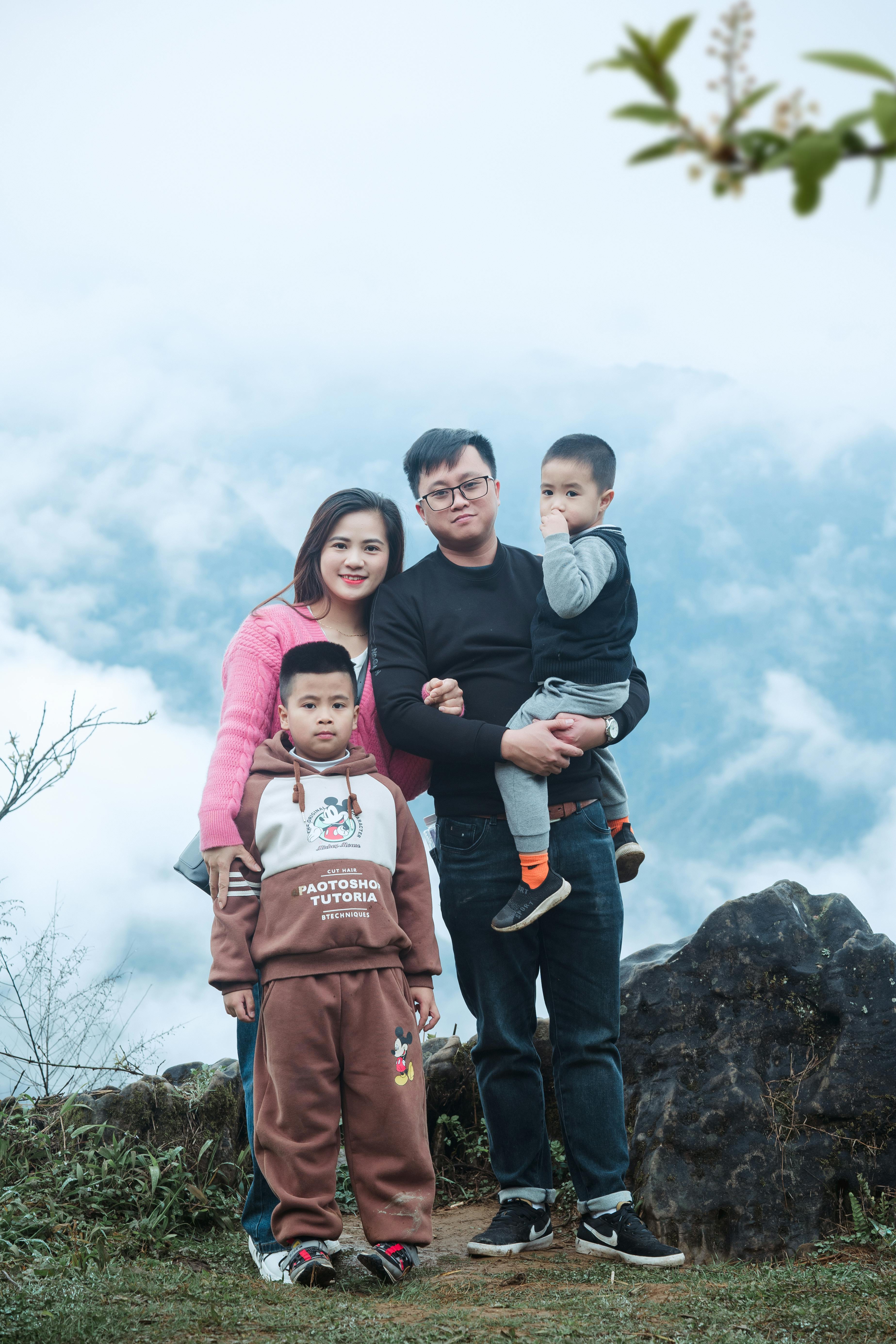 Family Portrait in a Fogged Mountain Landscape · Free Stock Photo