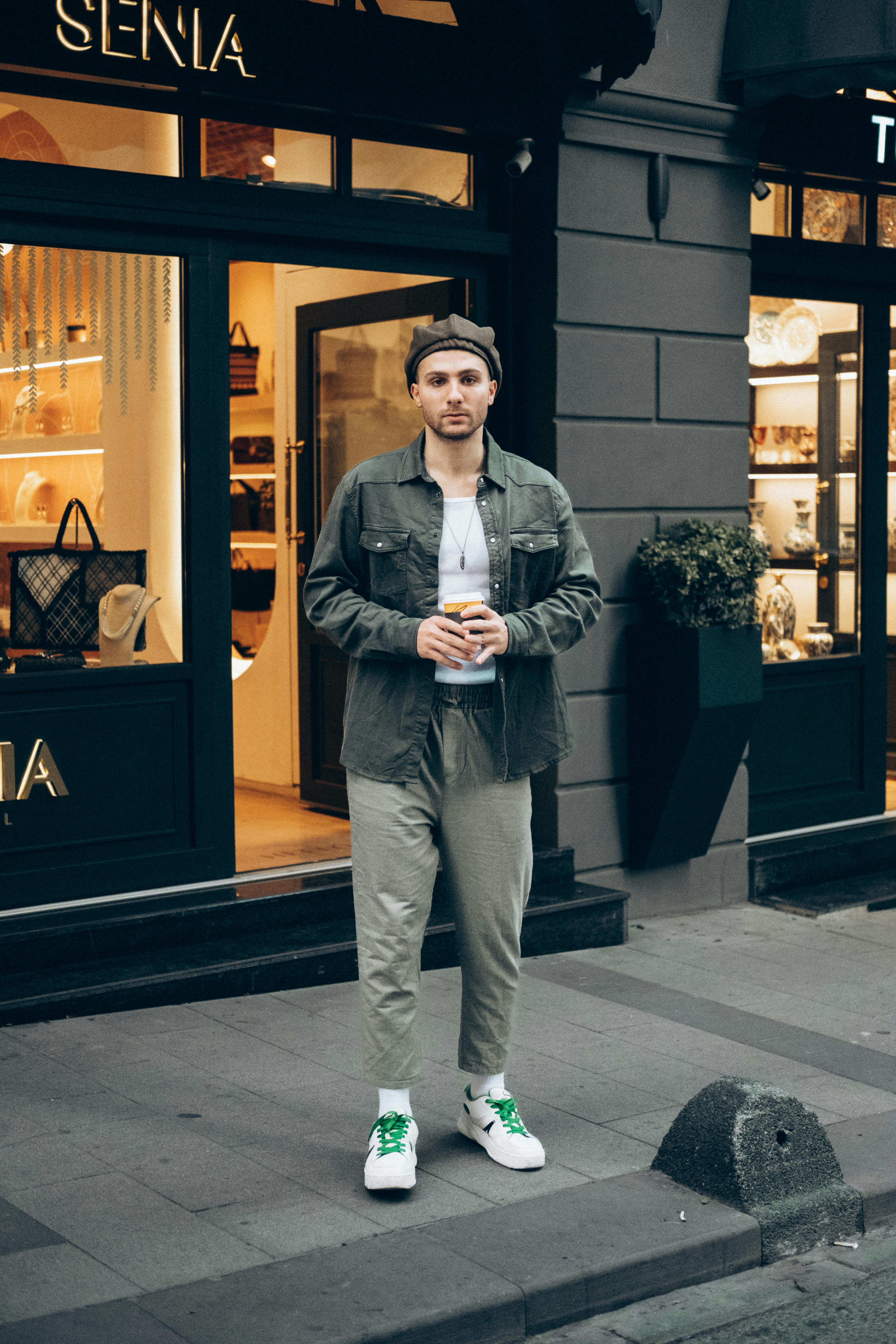 Man in Jacket Standing near Store · Free Stock Photo