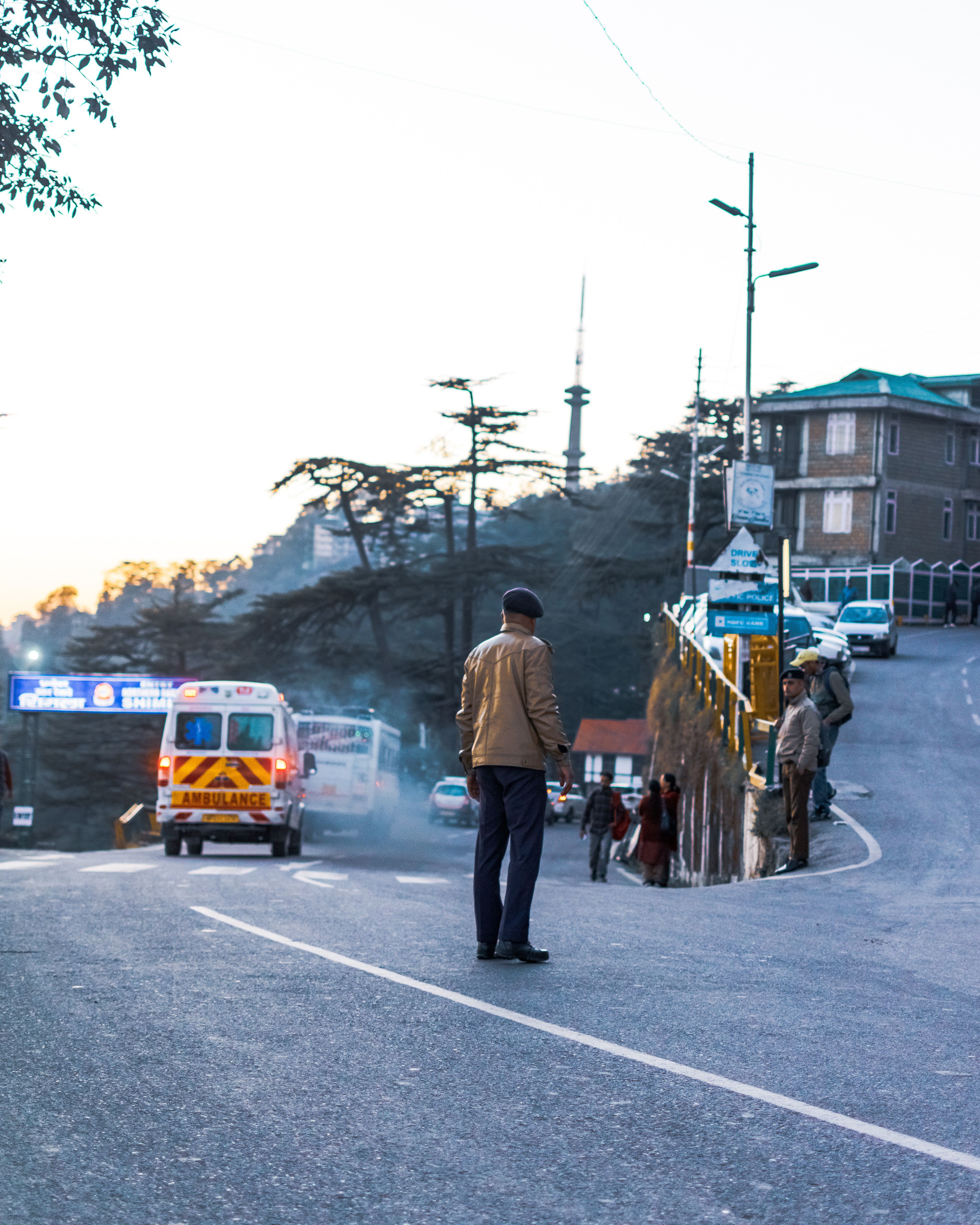 Man Standing on Street in Village · Free Stock Photo