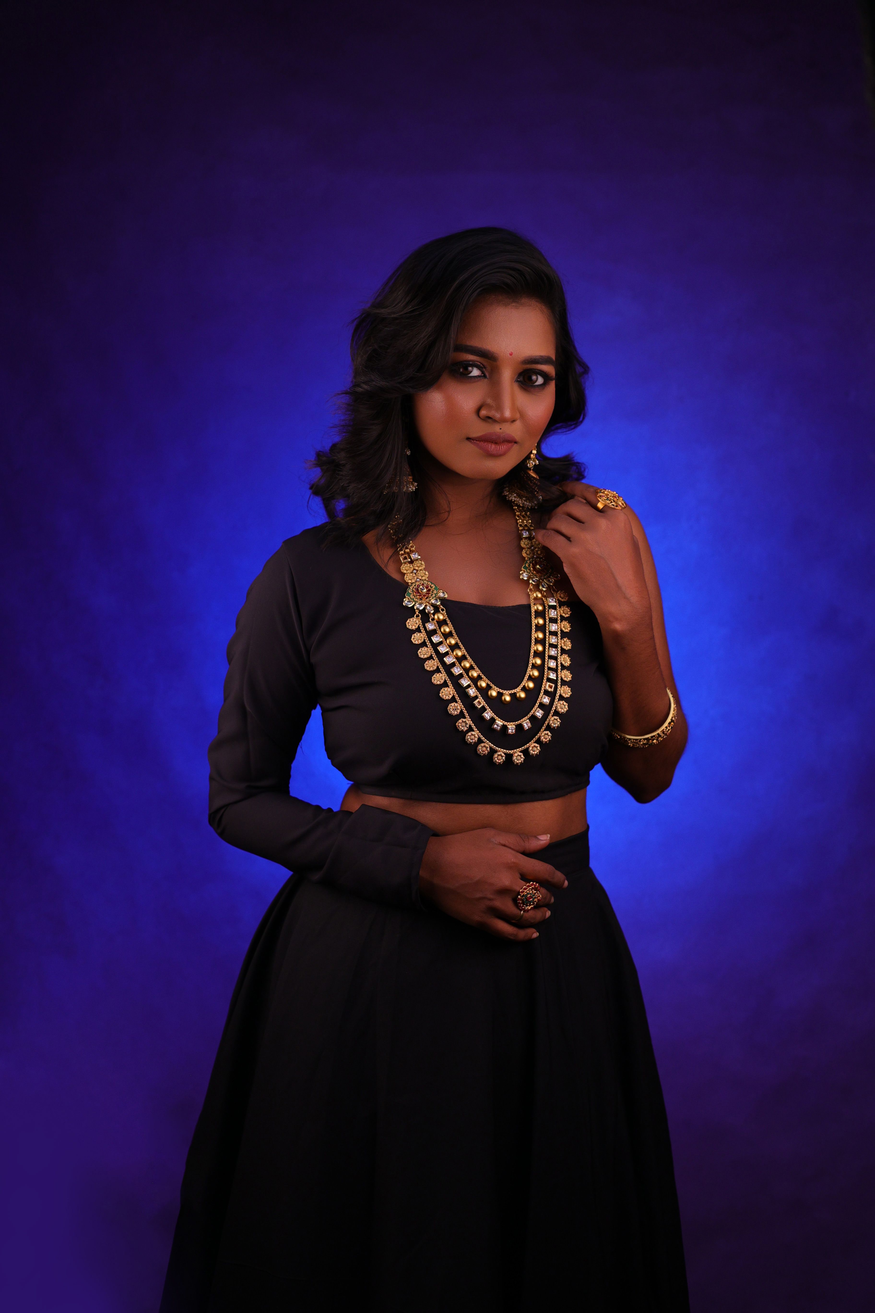 Portrait of Woman in Blue Background · Free Stock Photo