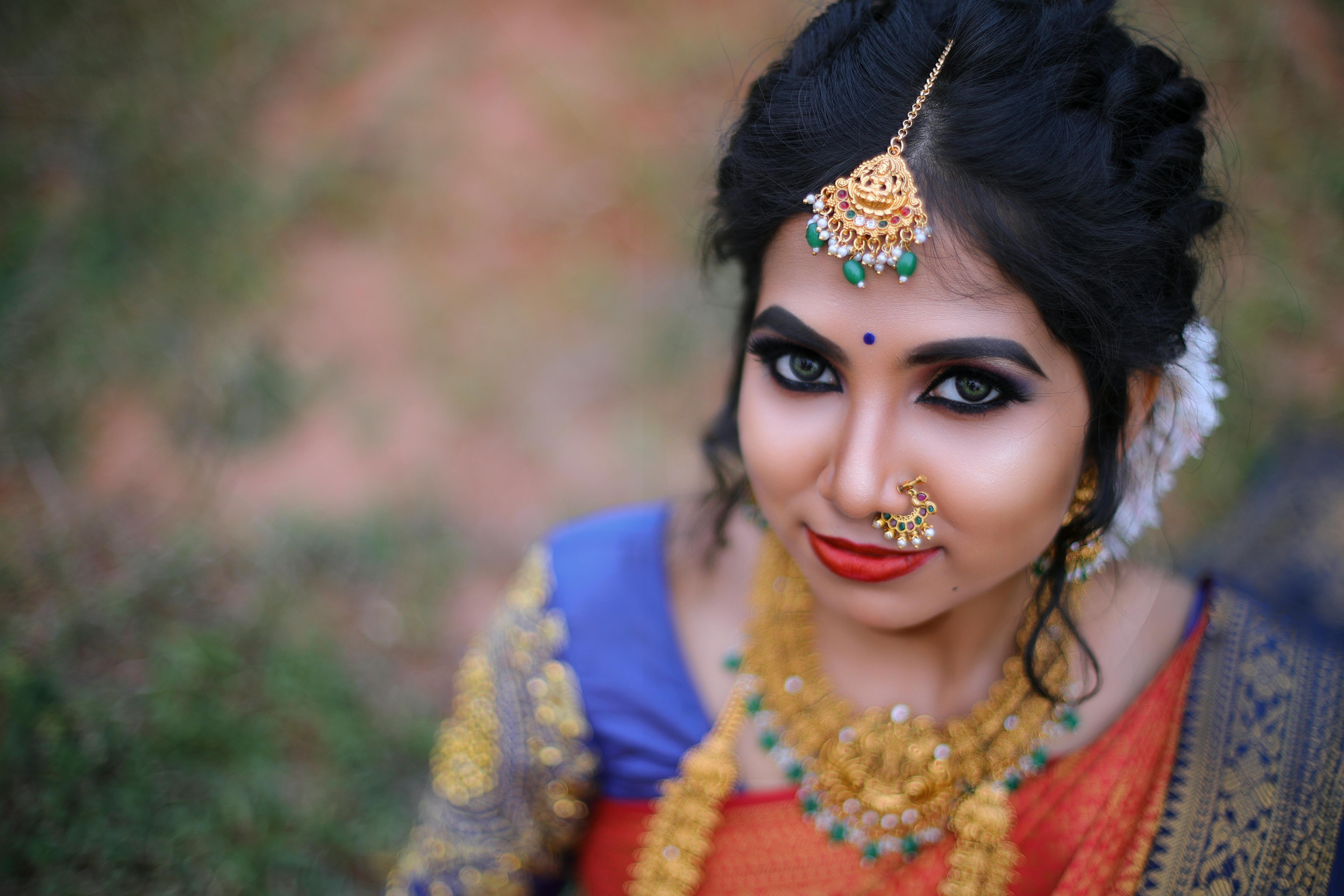 Bride in Traditional Clothing Holding Garland and Smiling · Free Stock ...