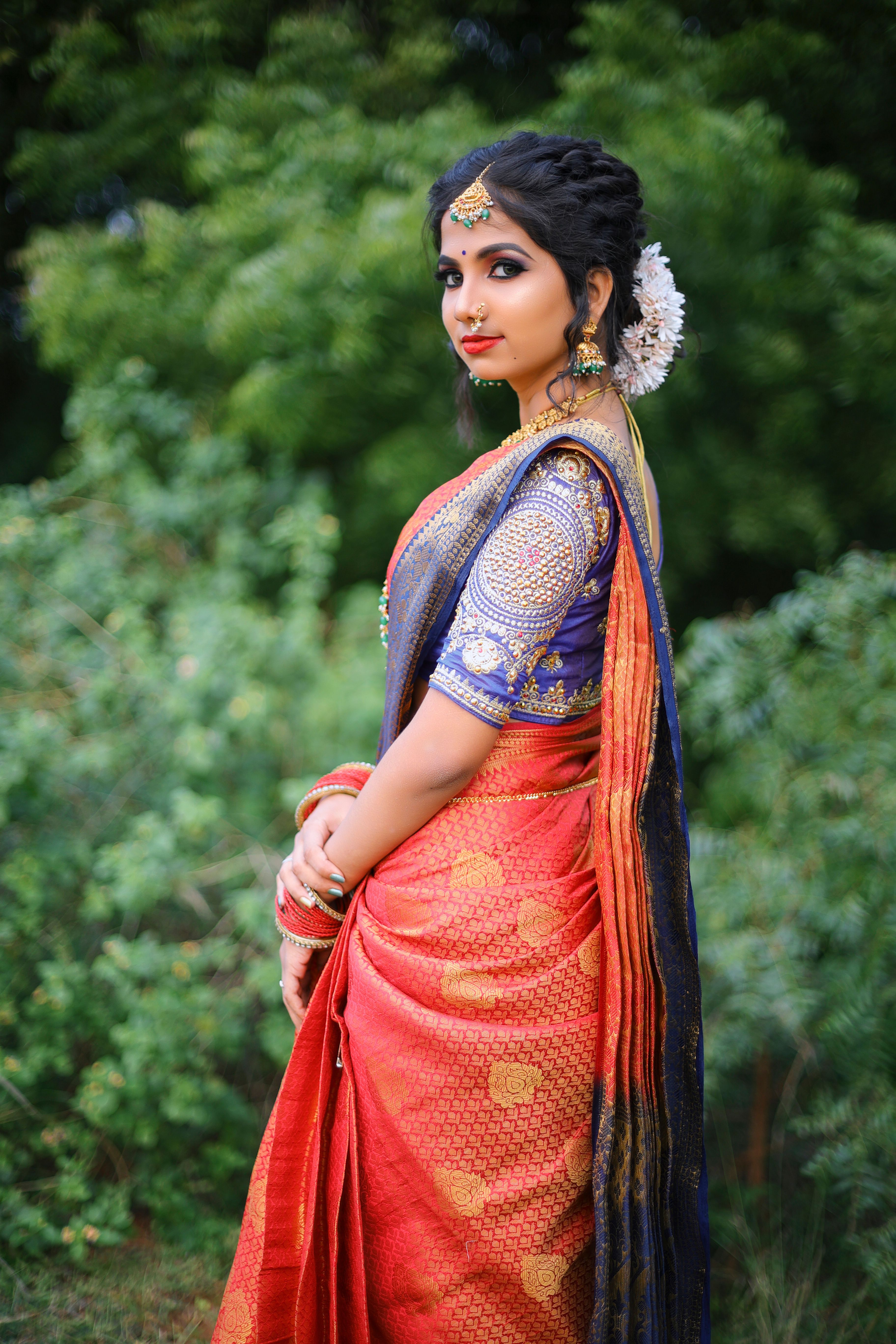 Model in Red Sari with Silver Sequin Floral Patterns · Free Stock Photo