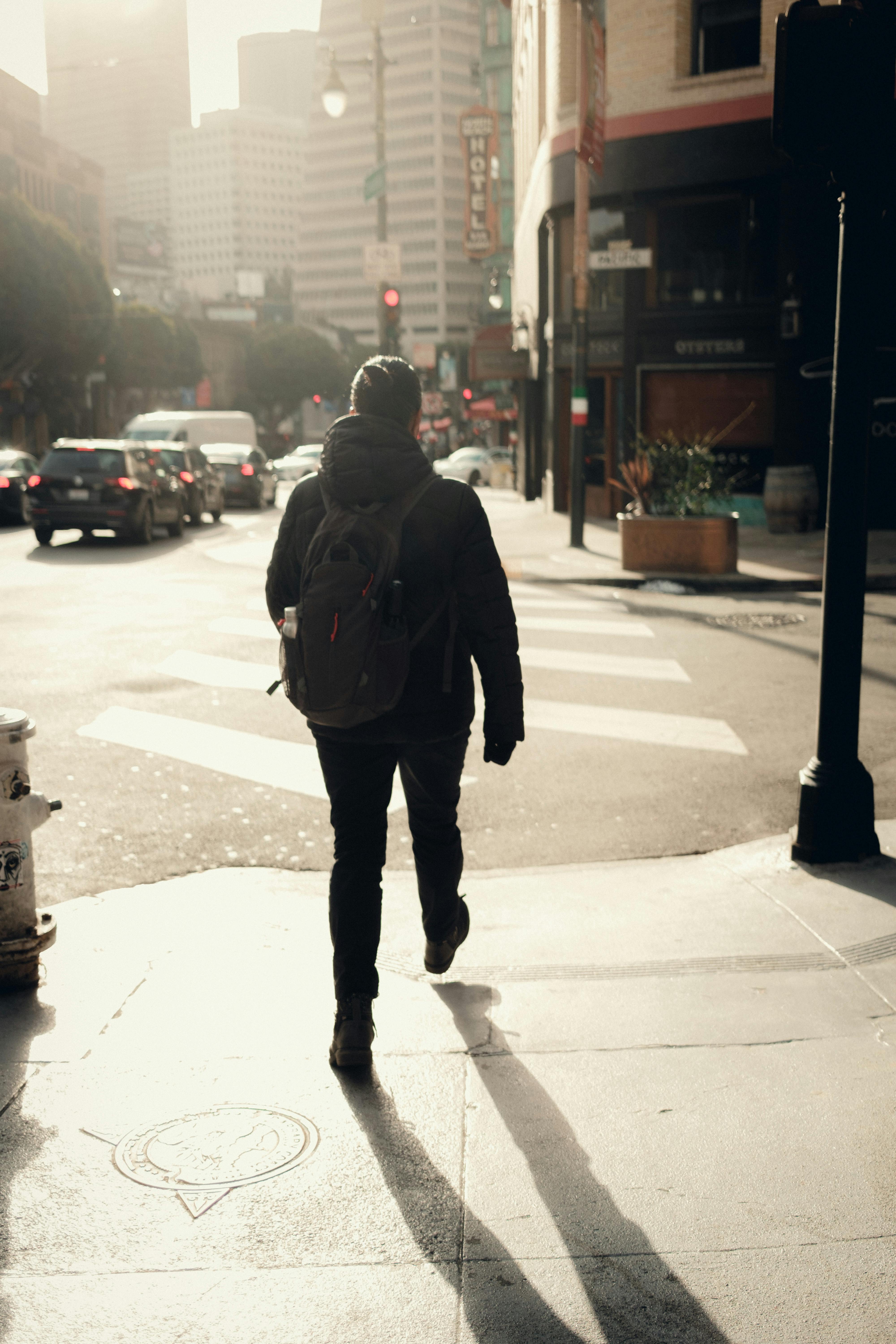Man Walking on Sidewalk · Free Stock Photo