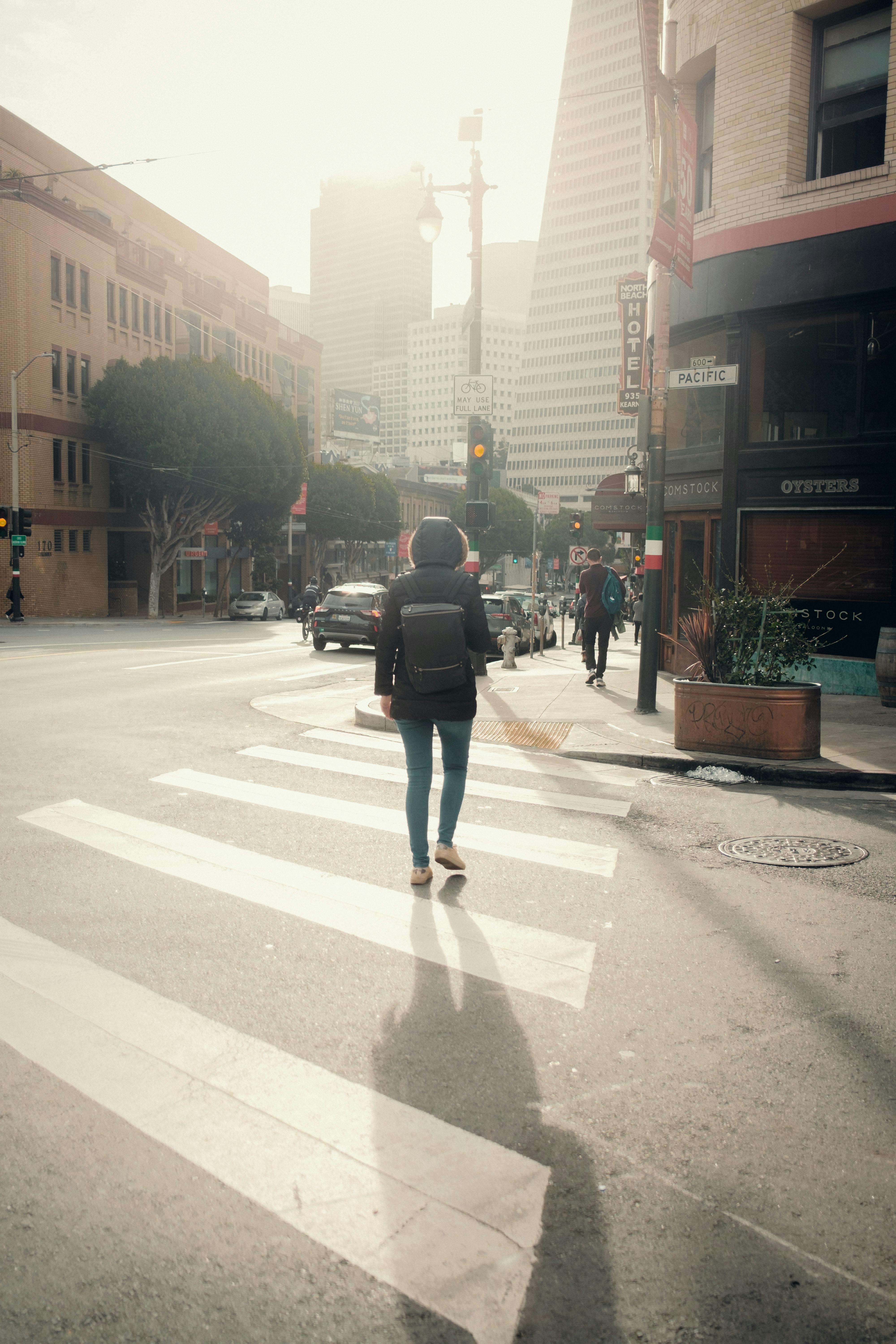 Back View of Person Crossing Street · Free Stock Photo