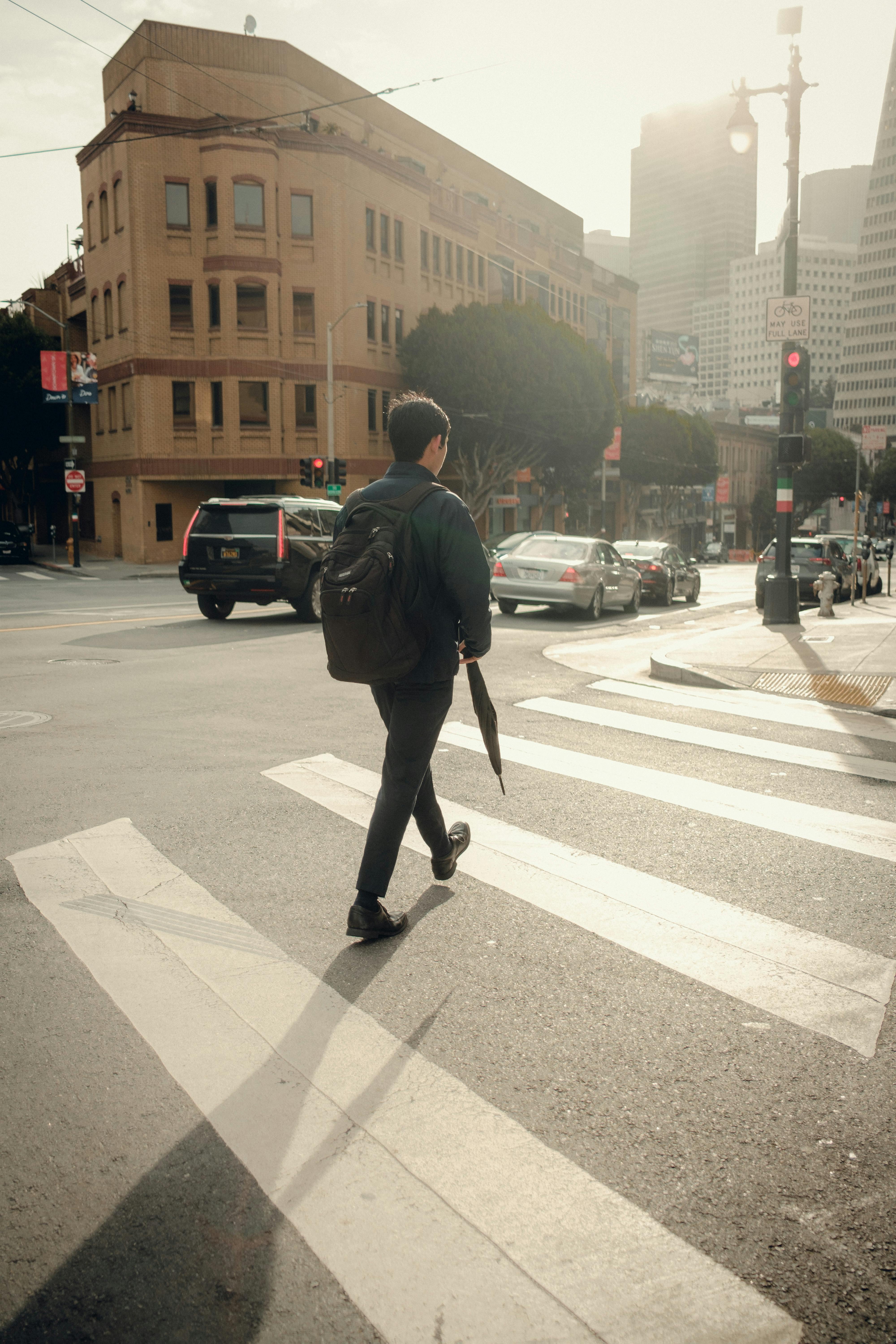 Man Walking on Crosswalk · Free Stock Photo