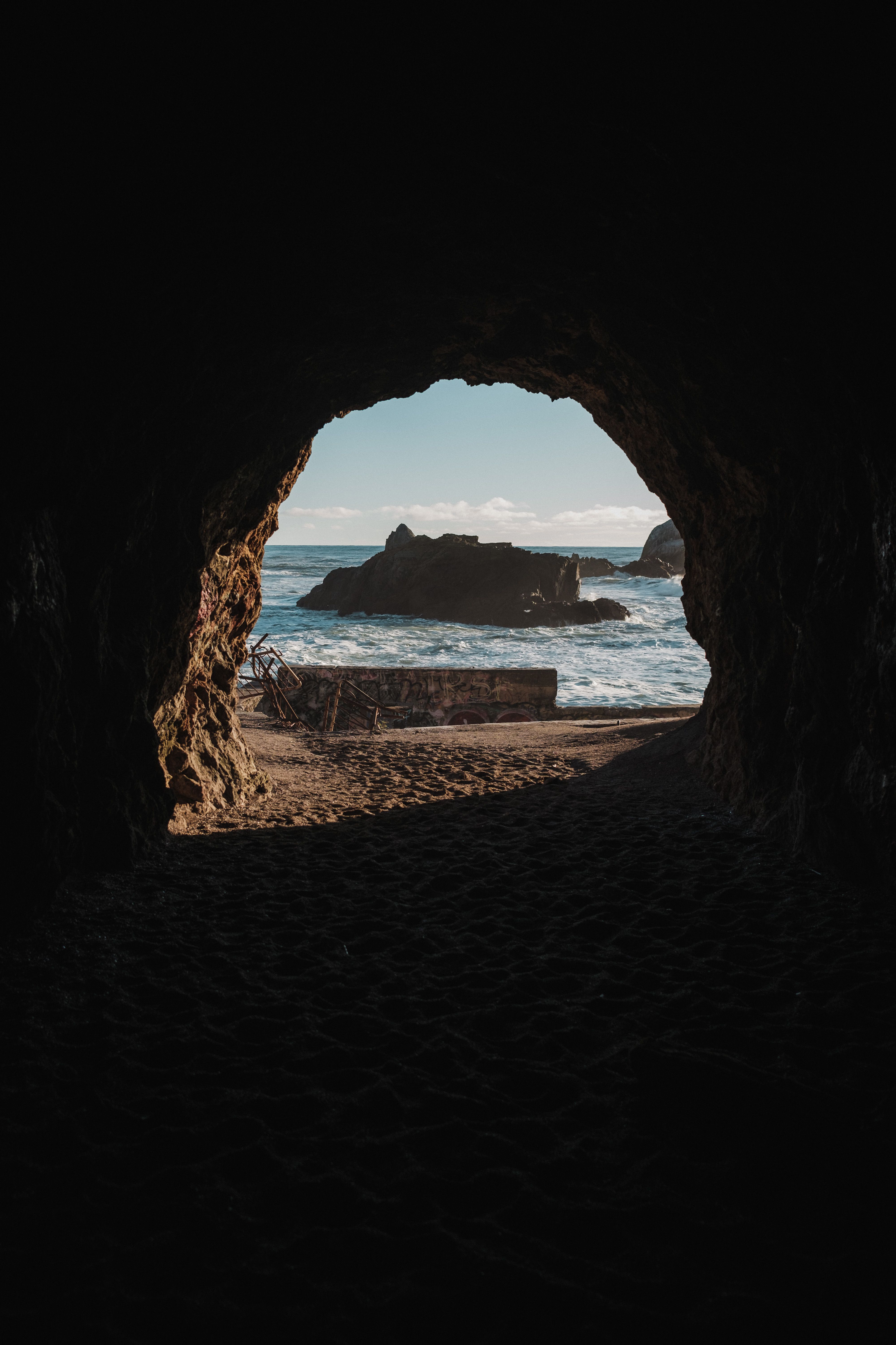 Sea Shore behind Cave Darkness · Free Stock Photo