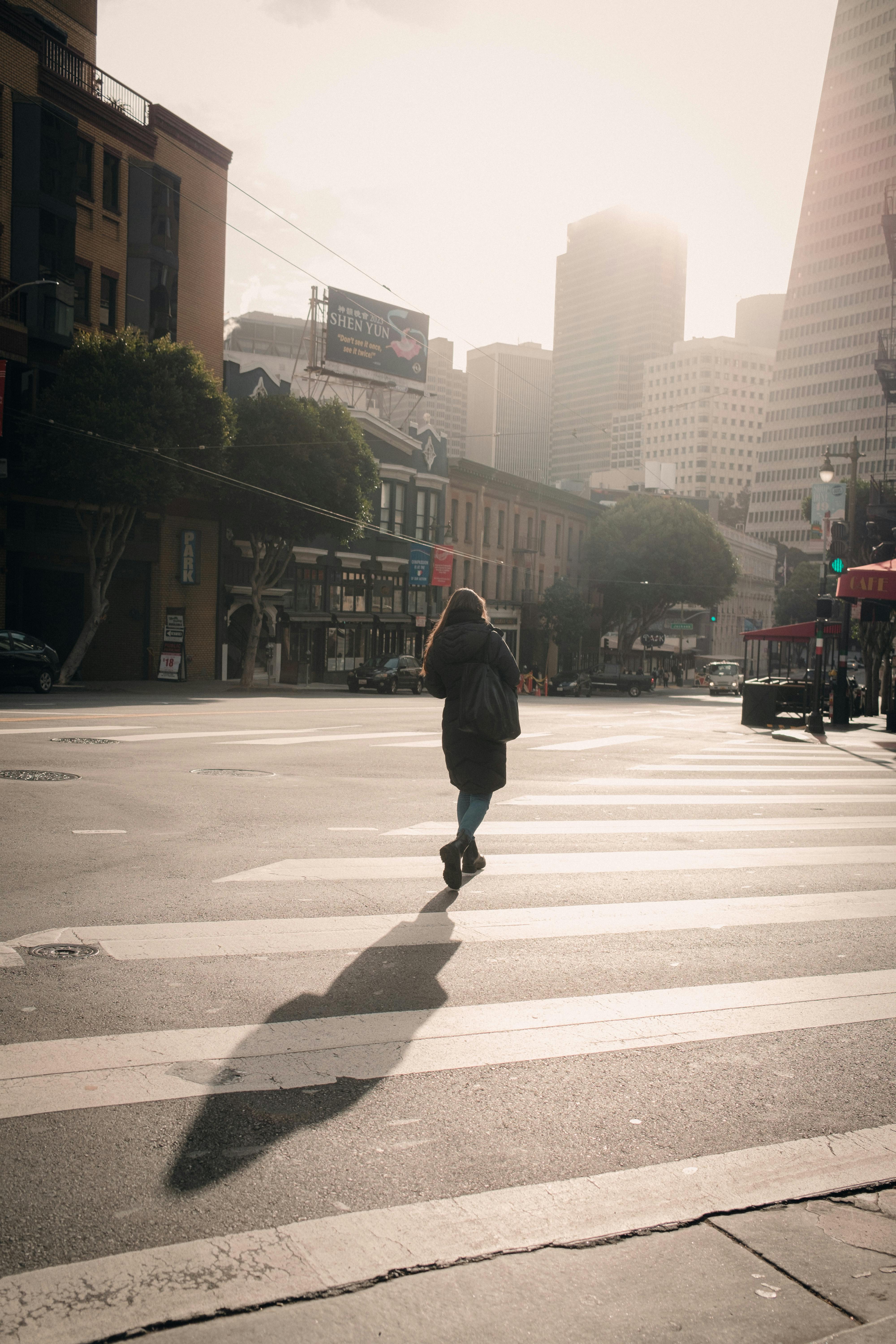 Woman Crossing Street in Downtown · Free Stock Photo