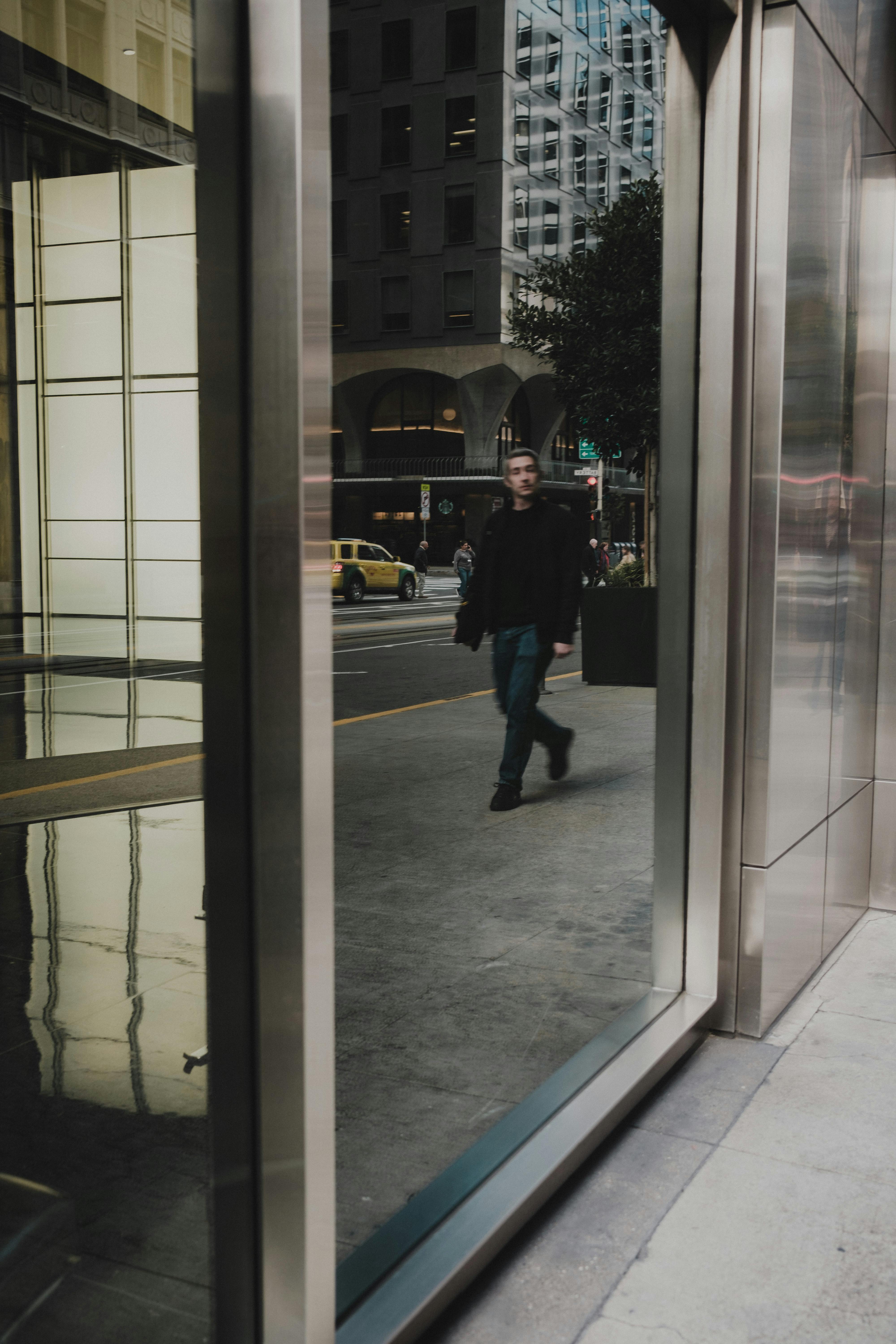 Walking Man Reflection in Window · Free Stock Photo