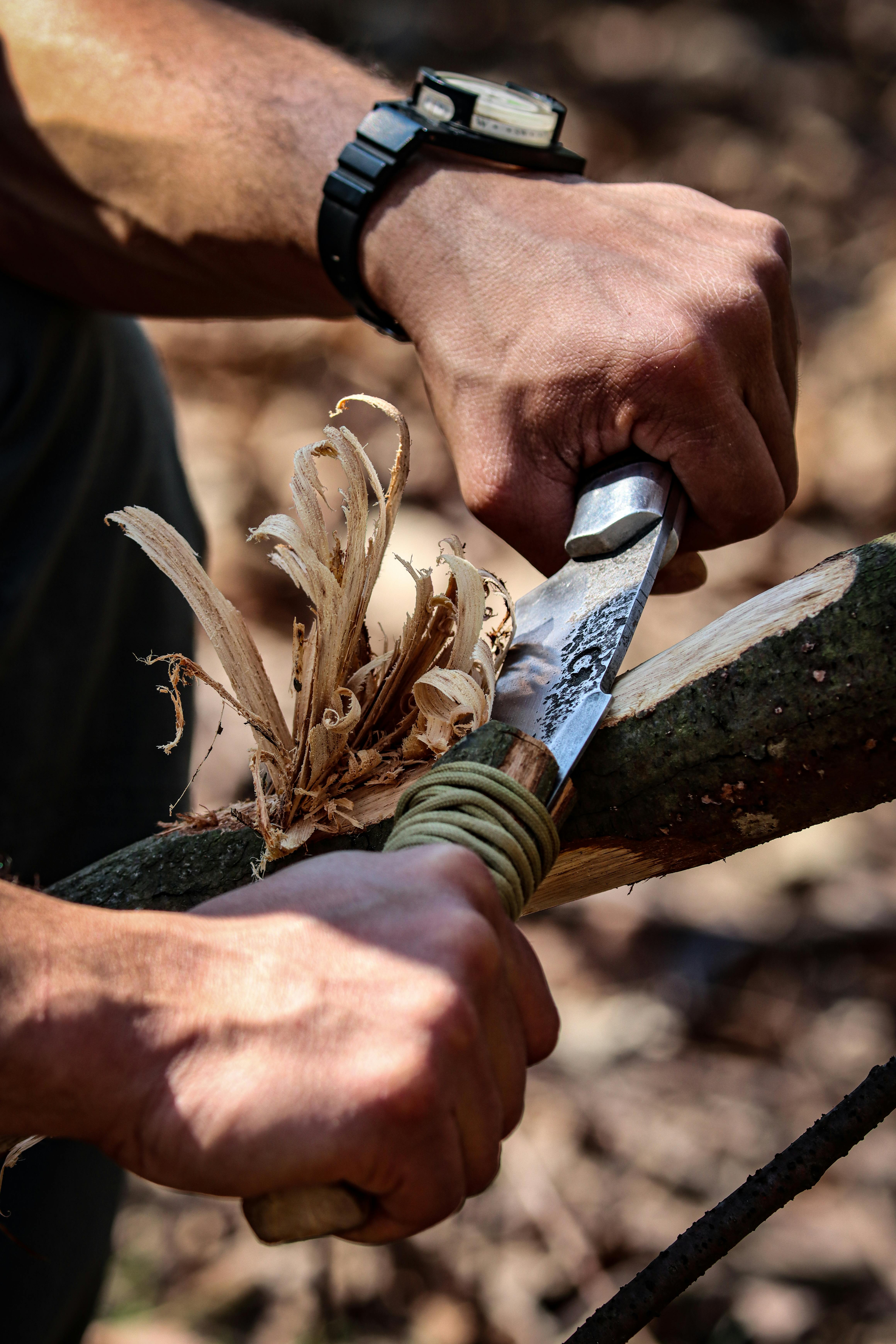 Man Carving Wood with Knife · Free Stock Photo