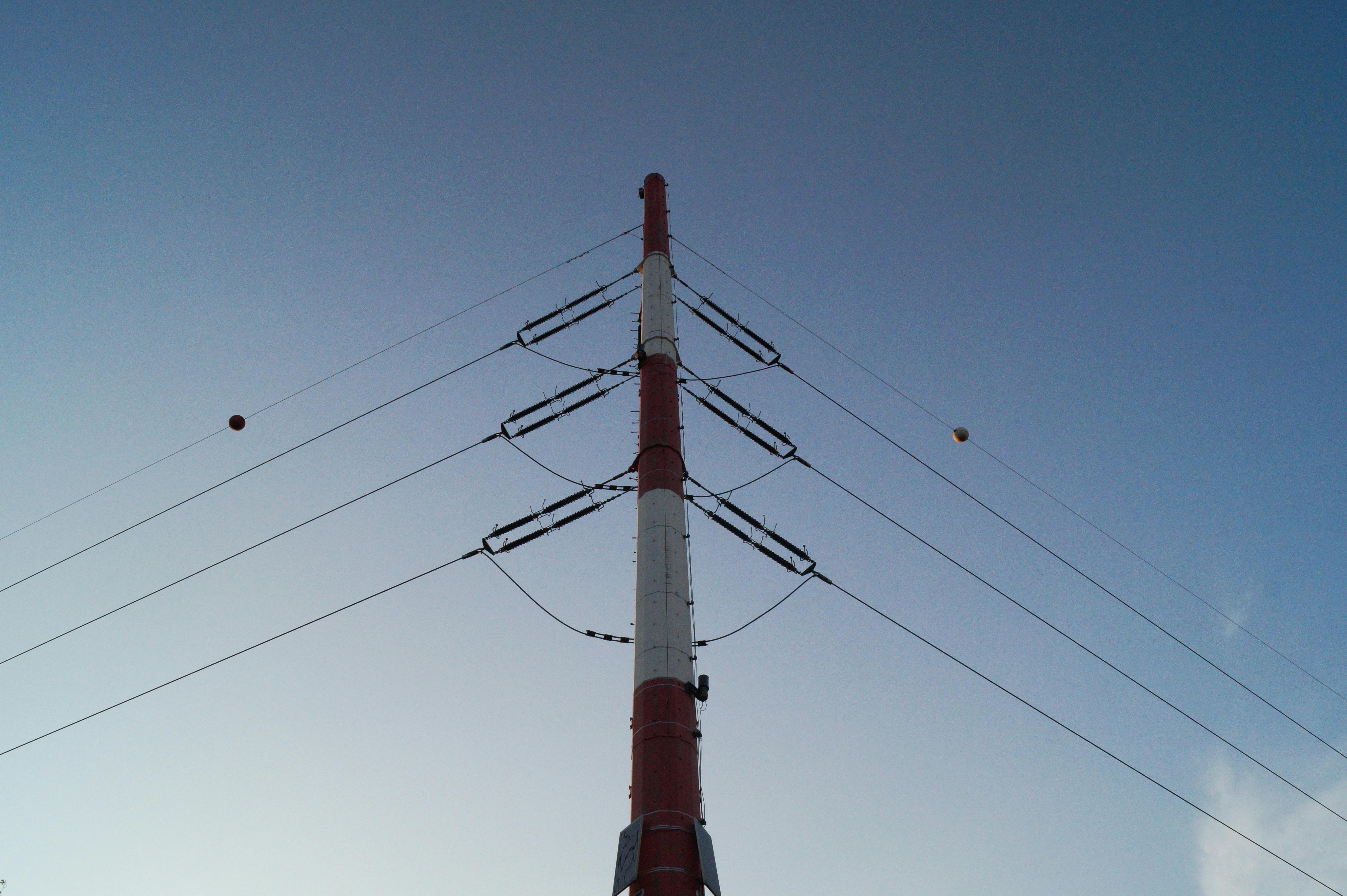 Low Angle Shot of a Utility Pole and Electricity Lines under Blue Sky ...